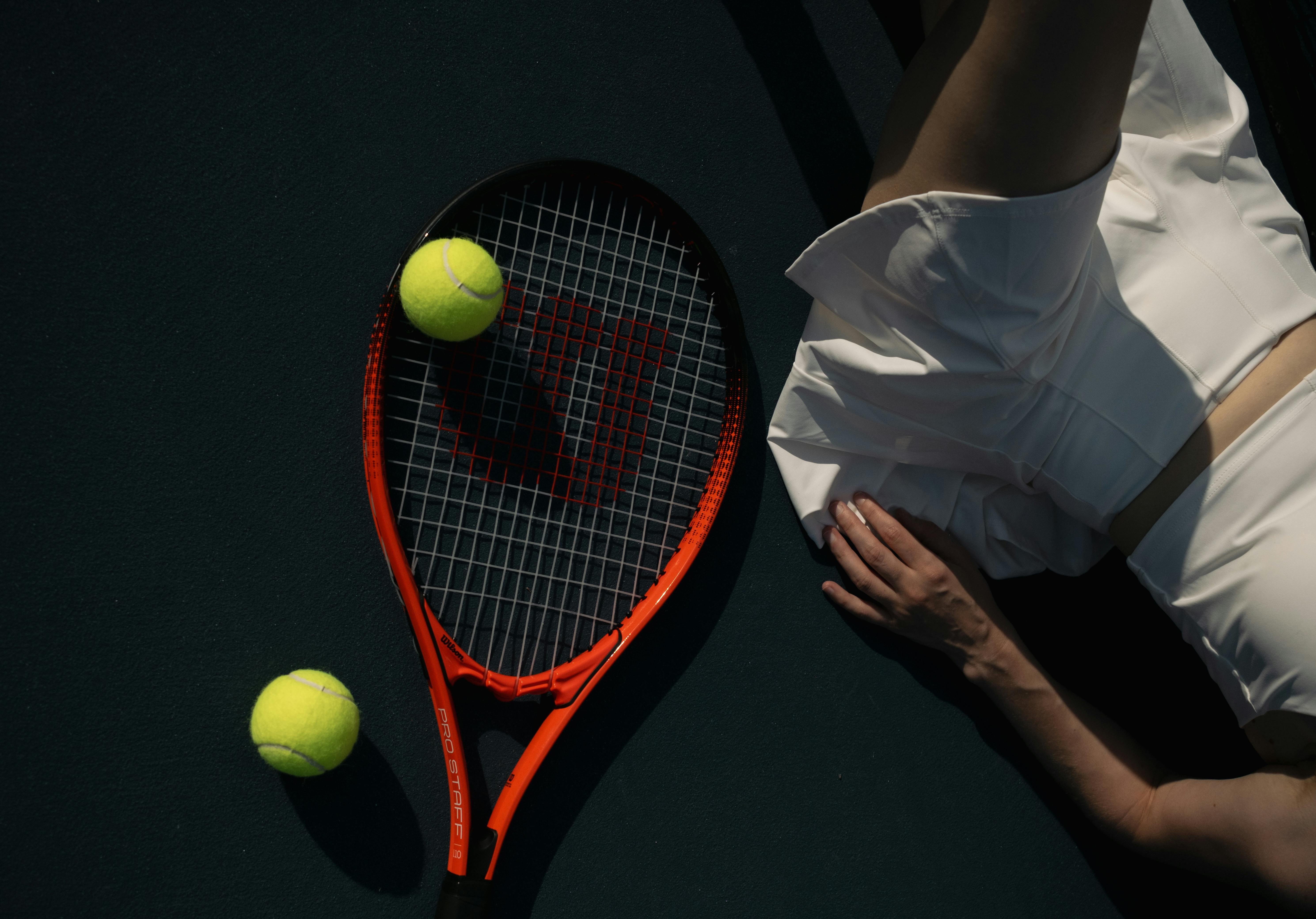 Chair on Tennis Court Next to Racket and Balls · Free Stock Photo
