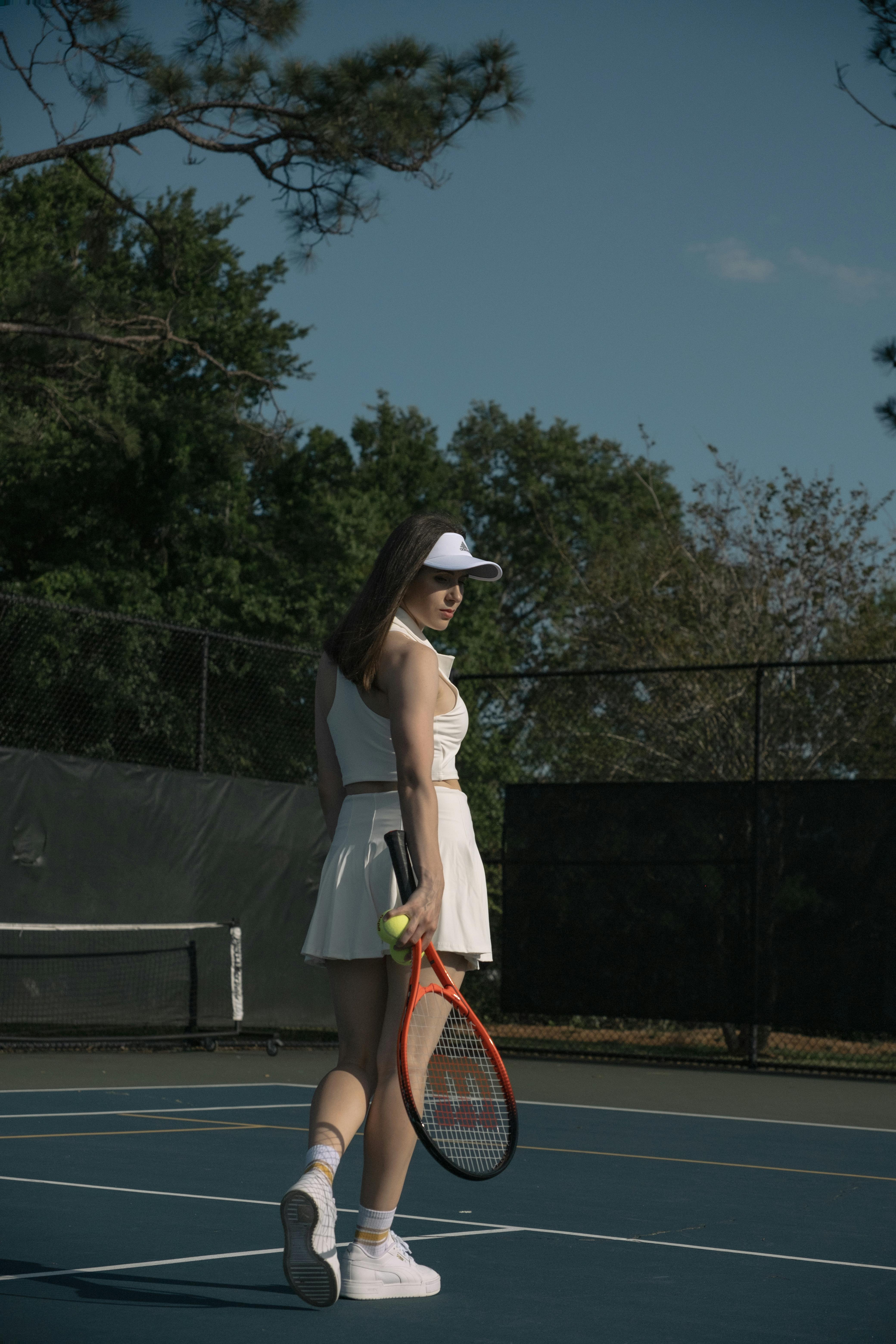 Chair on Tennis Court Next to Racket and Balls · Free Stock Photo
