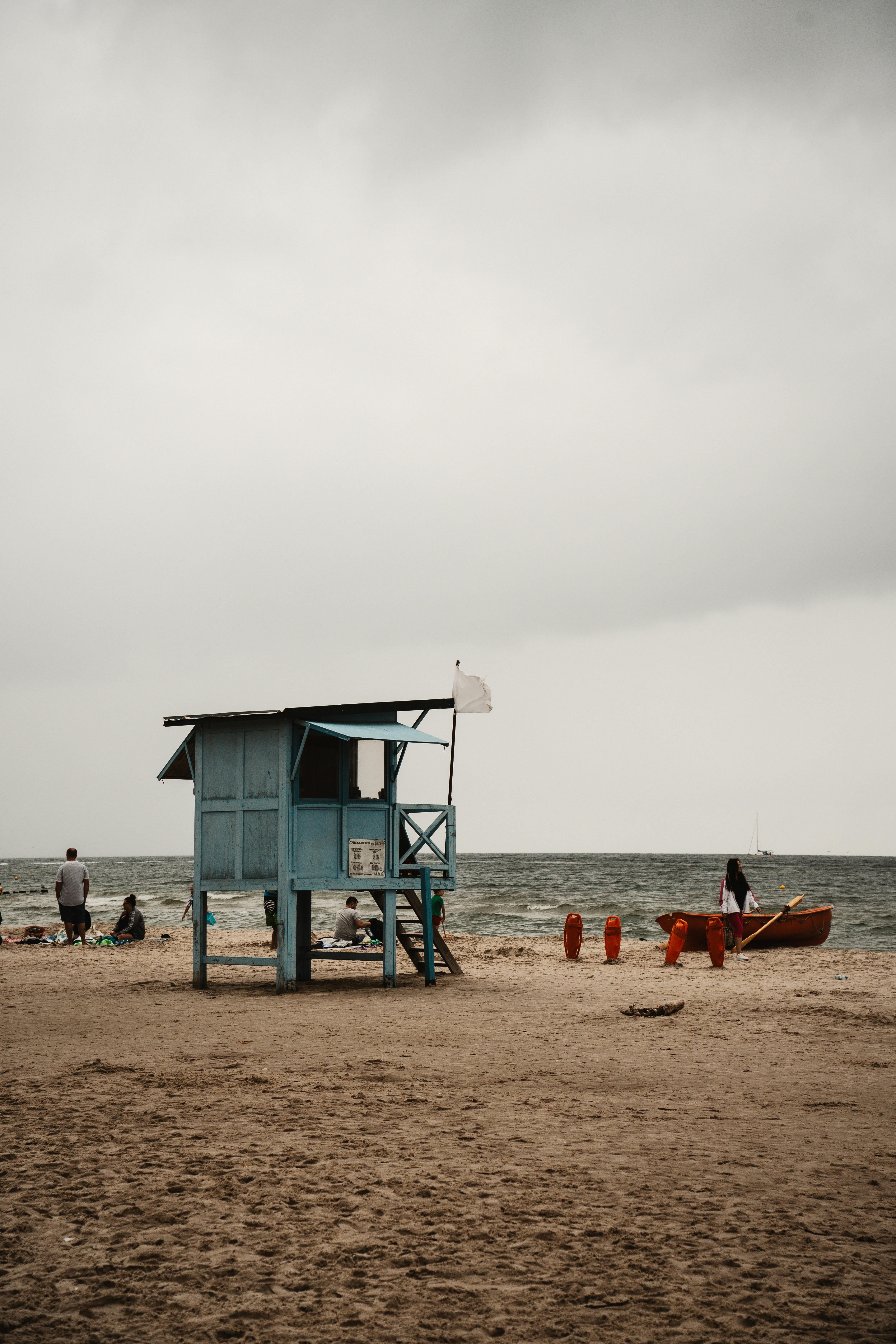 White Wooden Lifeguard House Near Shoreline · Free Stock Photo