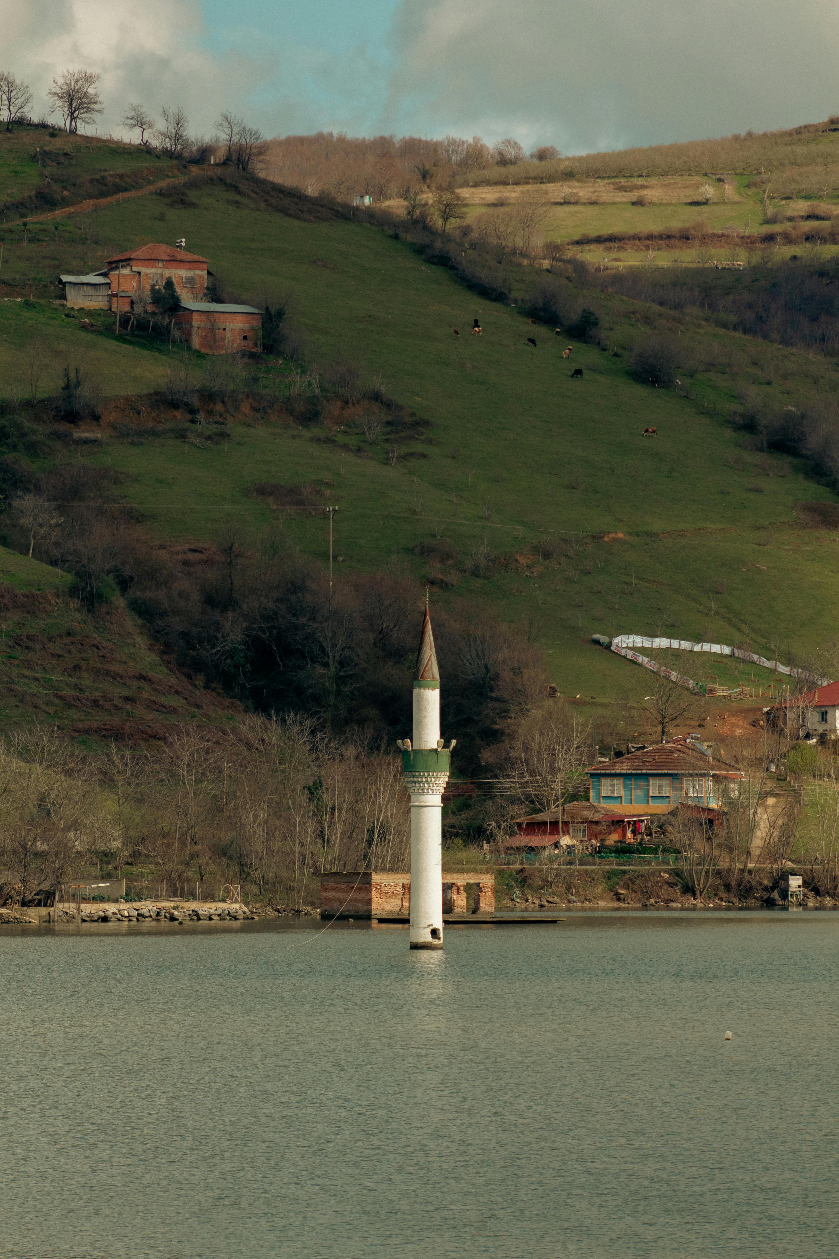 A Lighthouse on a Lake · Free Stock Photo