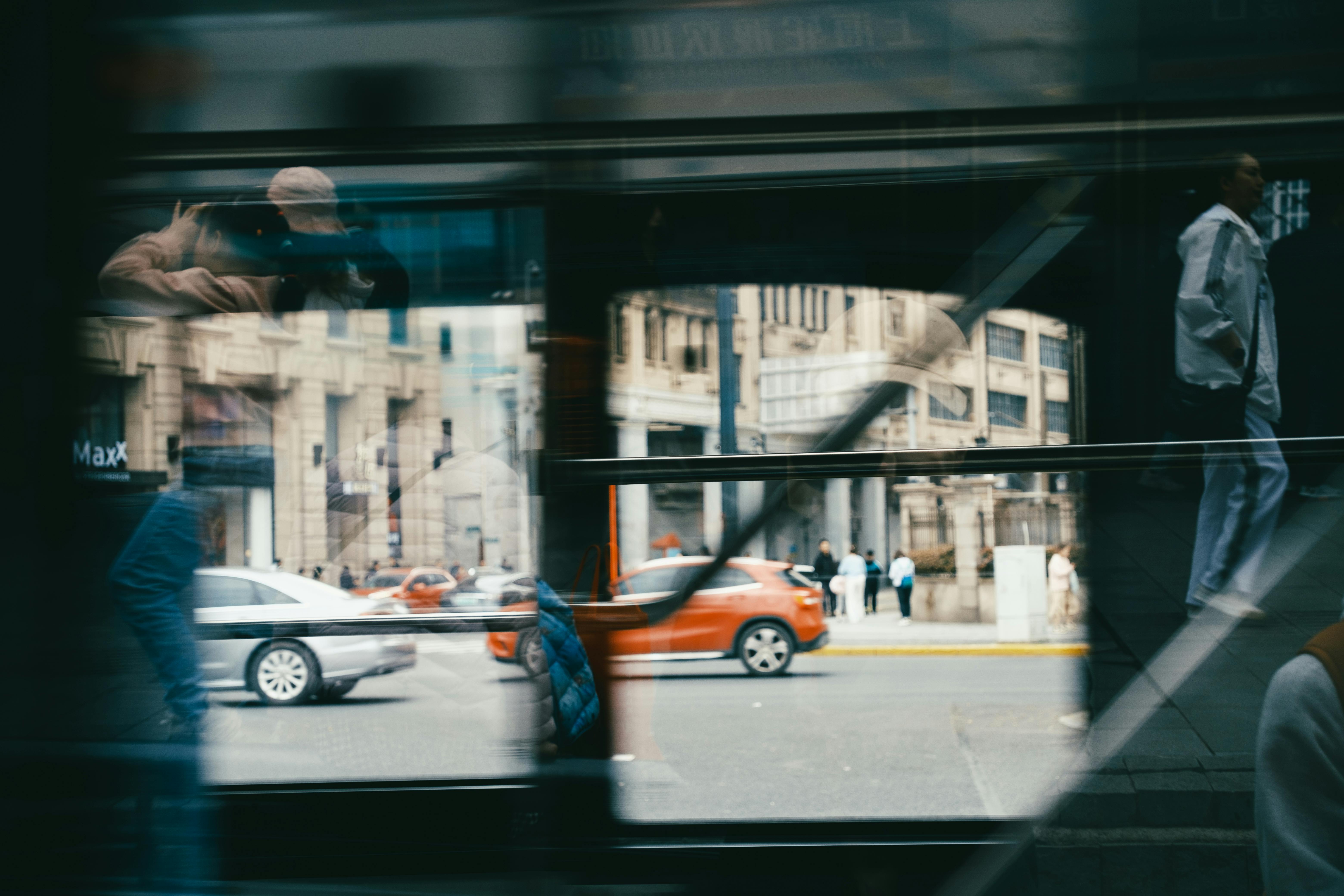 Cars on Street behind Bus Windows · Free Stock Photo