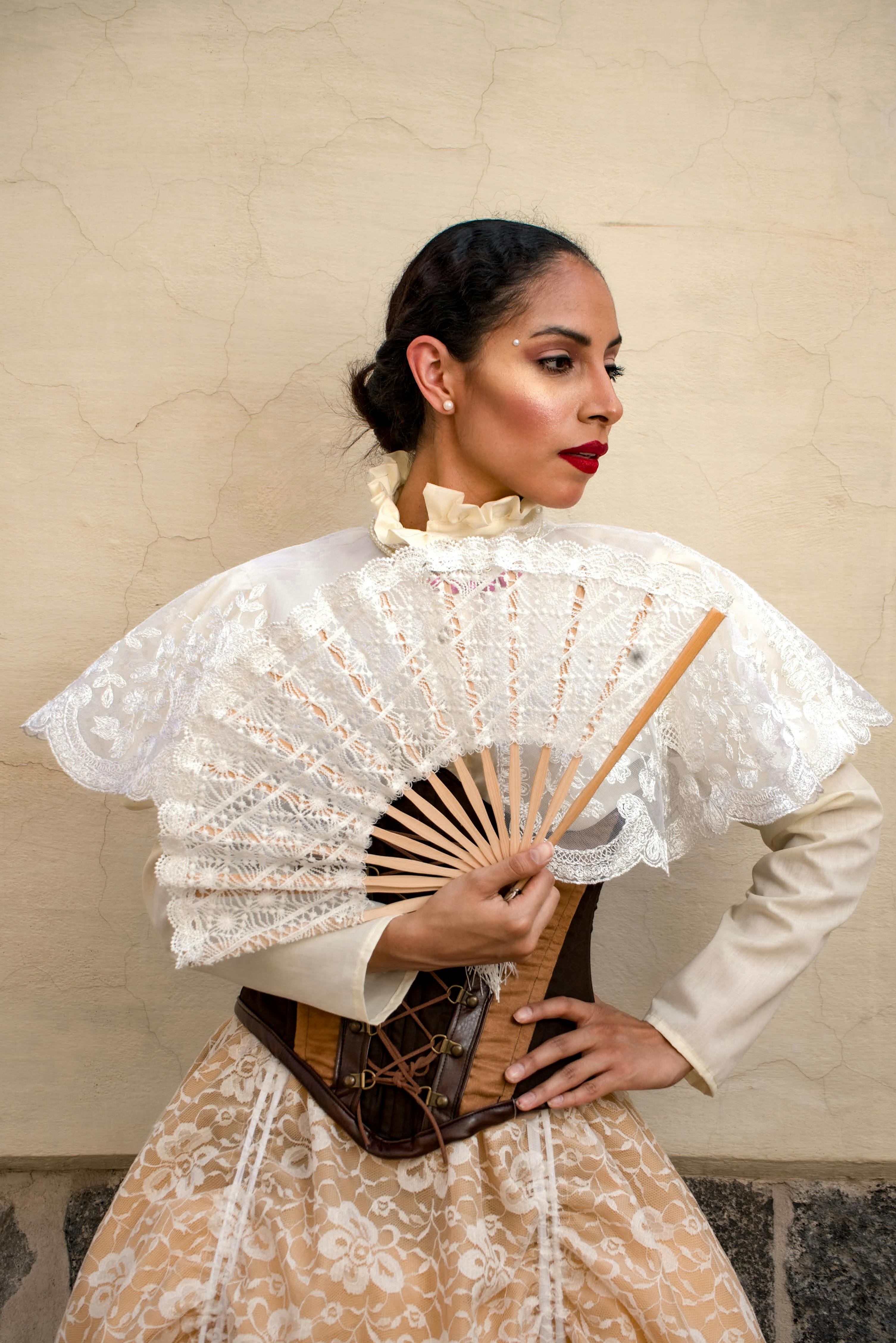 Model Holding a Hand Fan · Free Stock Photo