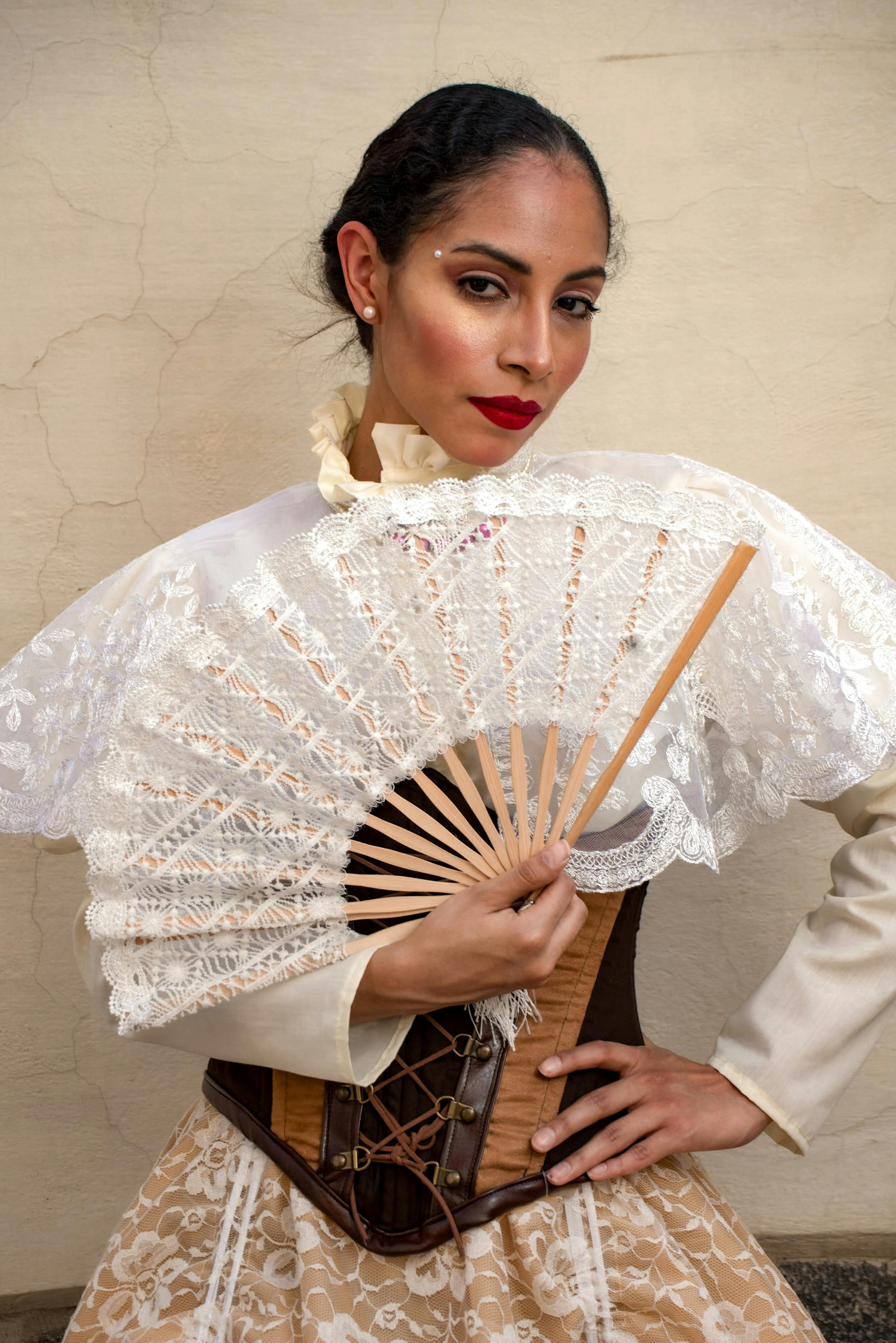 Portrait of Woman Holding Fan · Free Stock Photo