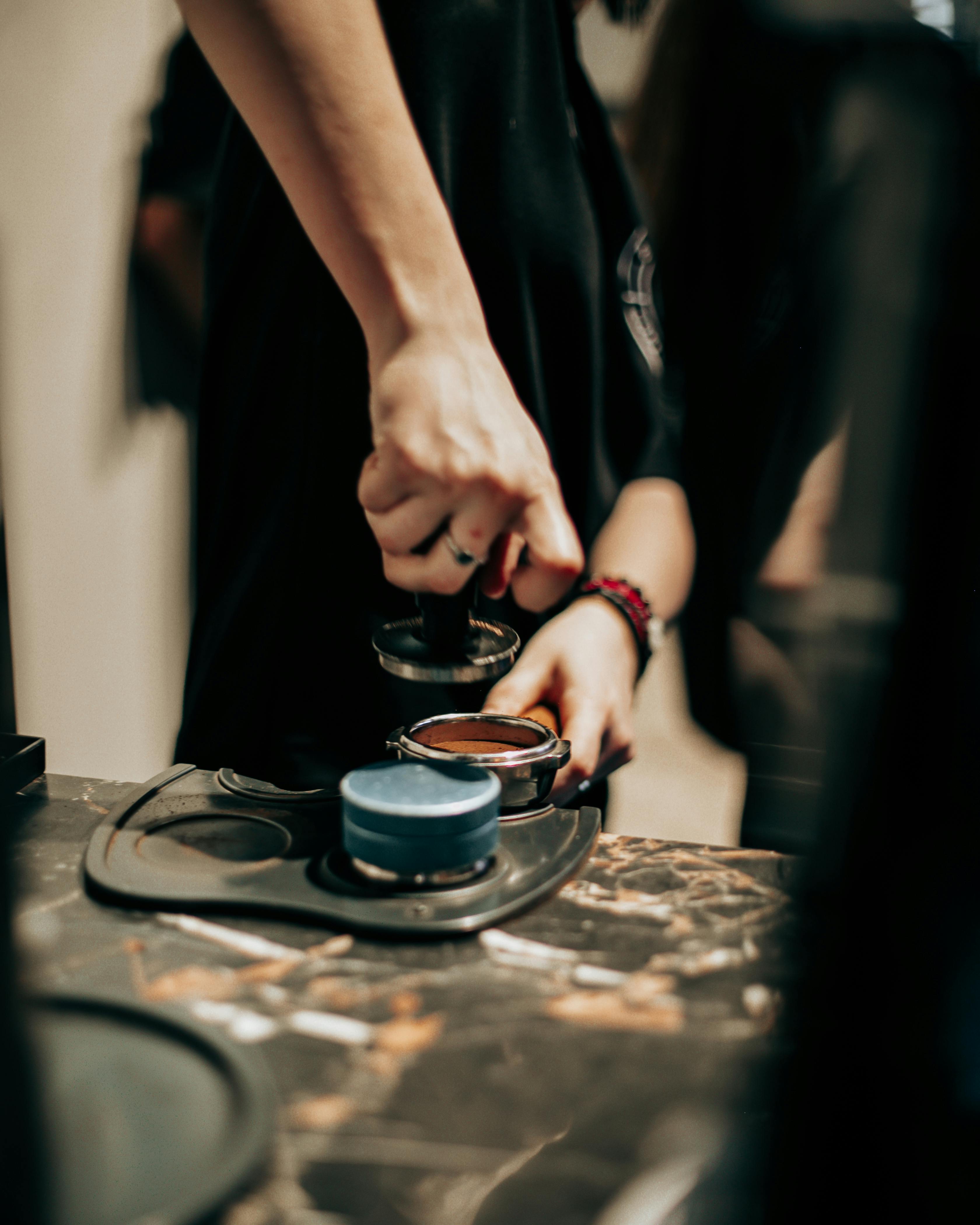 Barista Pressing Coffee for Espresso · Free Stock Photo