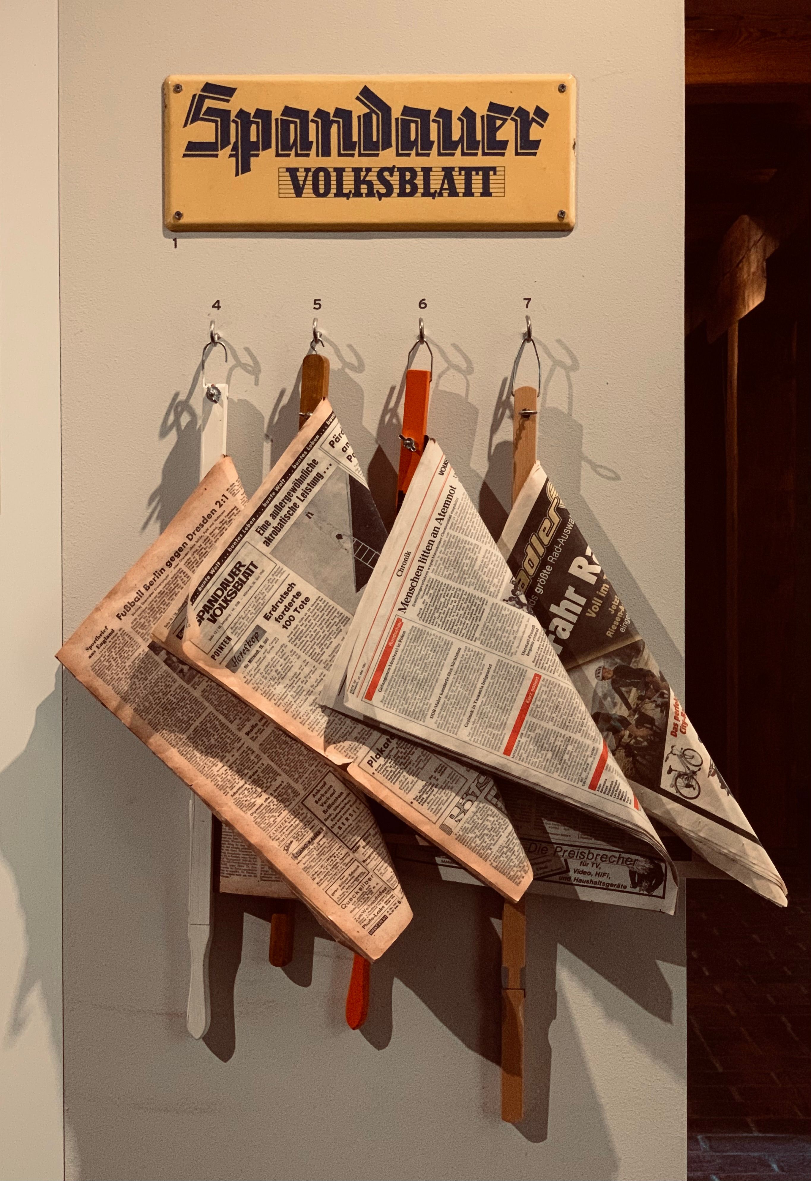 Newspapers Hanging on Wall · Free Stock Photo