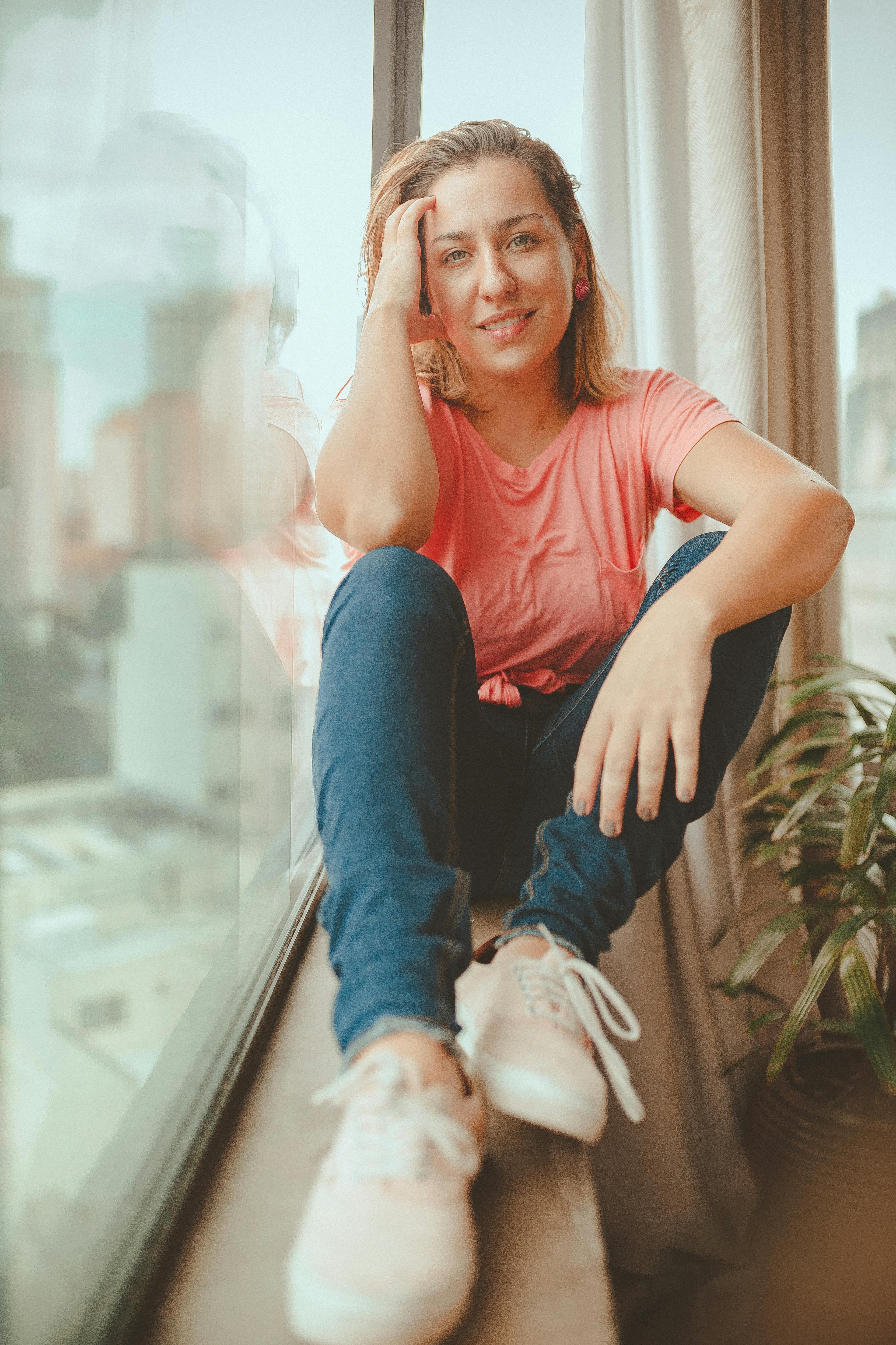 Woman Sitting on Window · Free Stock Photo