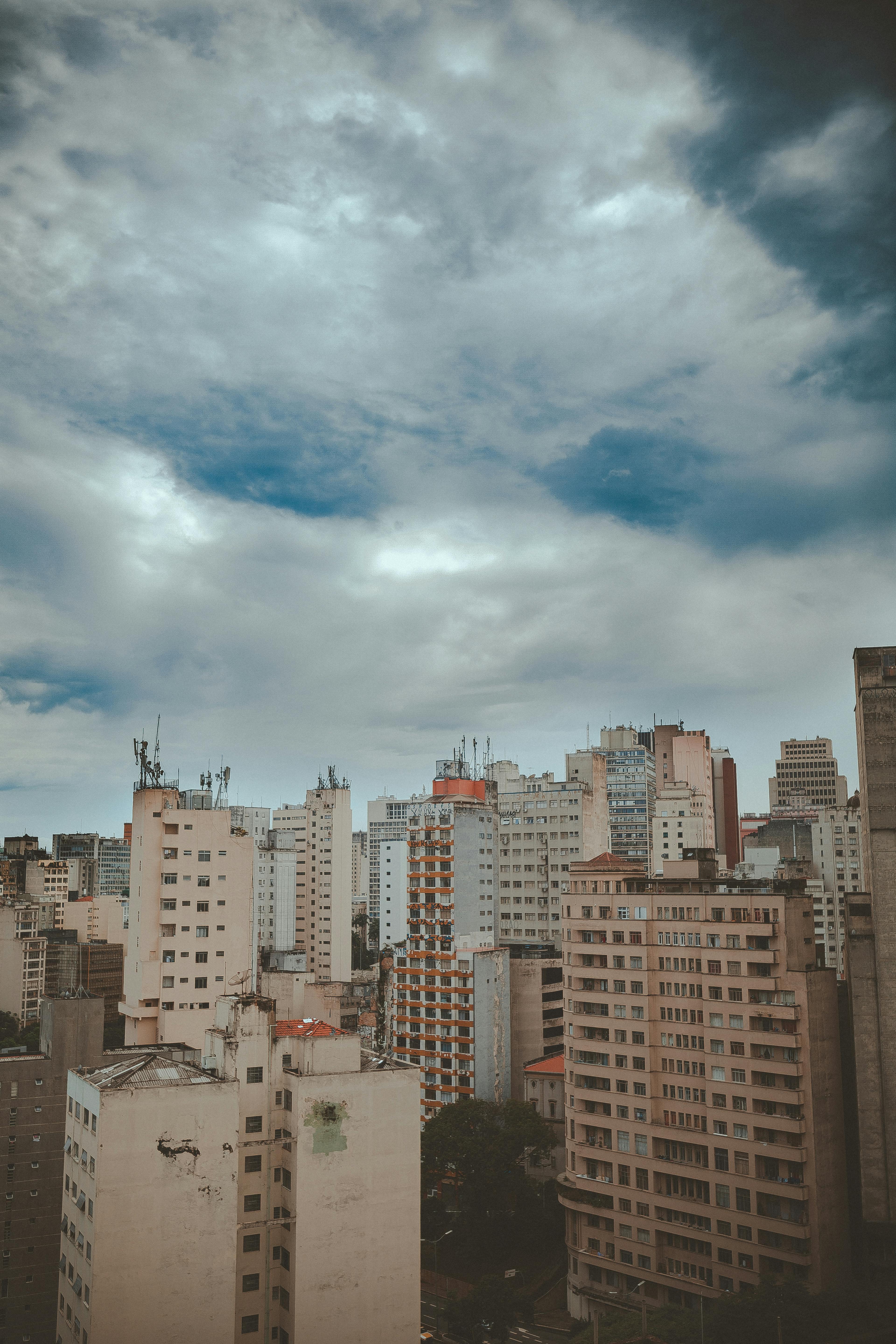 High Rise Building Under Cloudy Sky at Daytime · Free Stock Photo