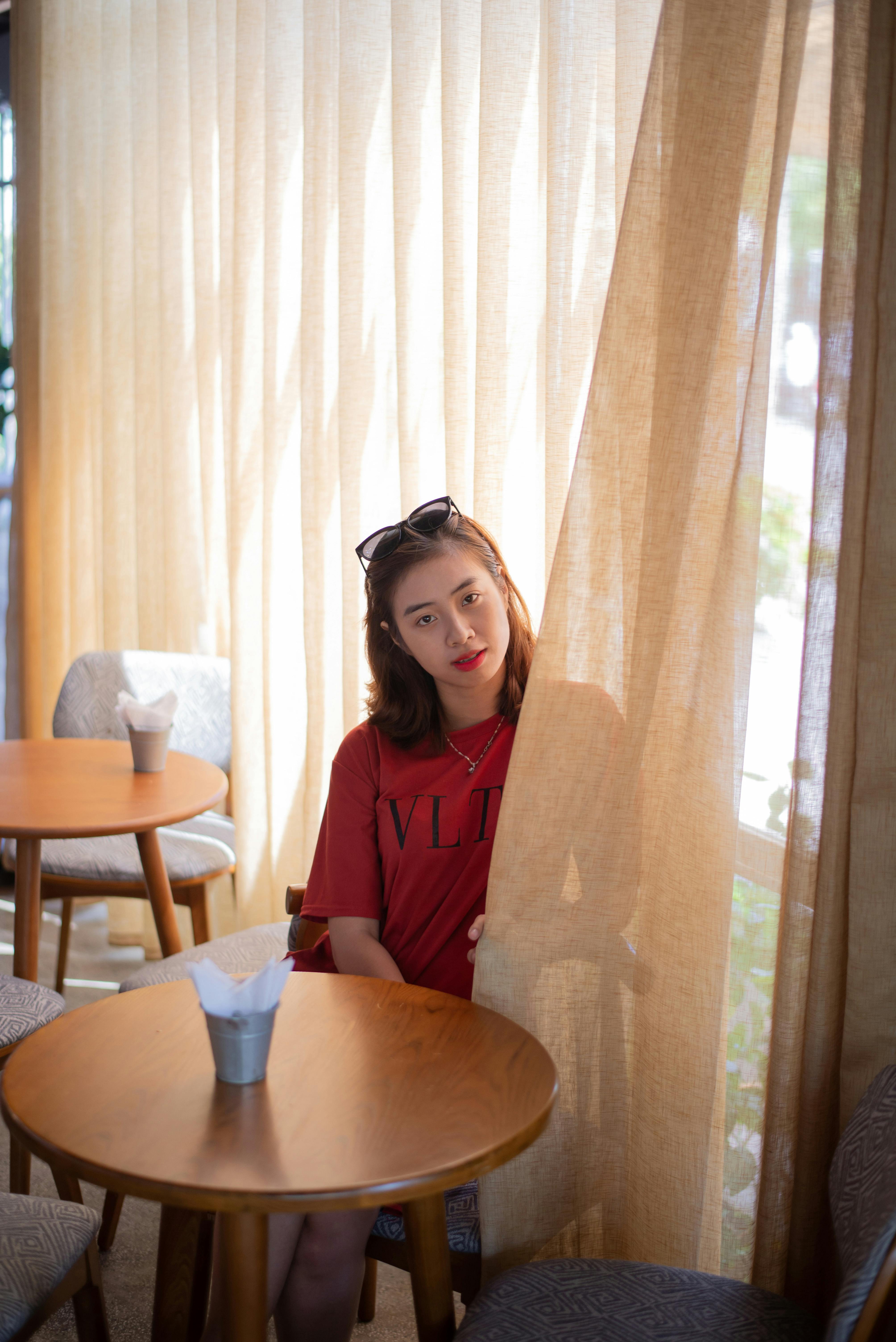 Girl Sitting on Chair Beside The Door · Free Stock Photo