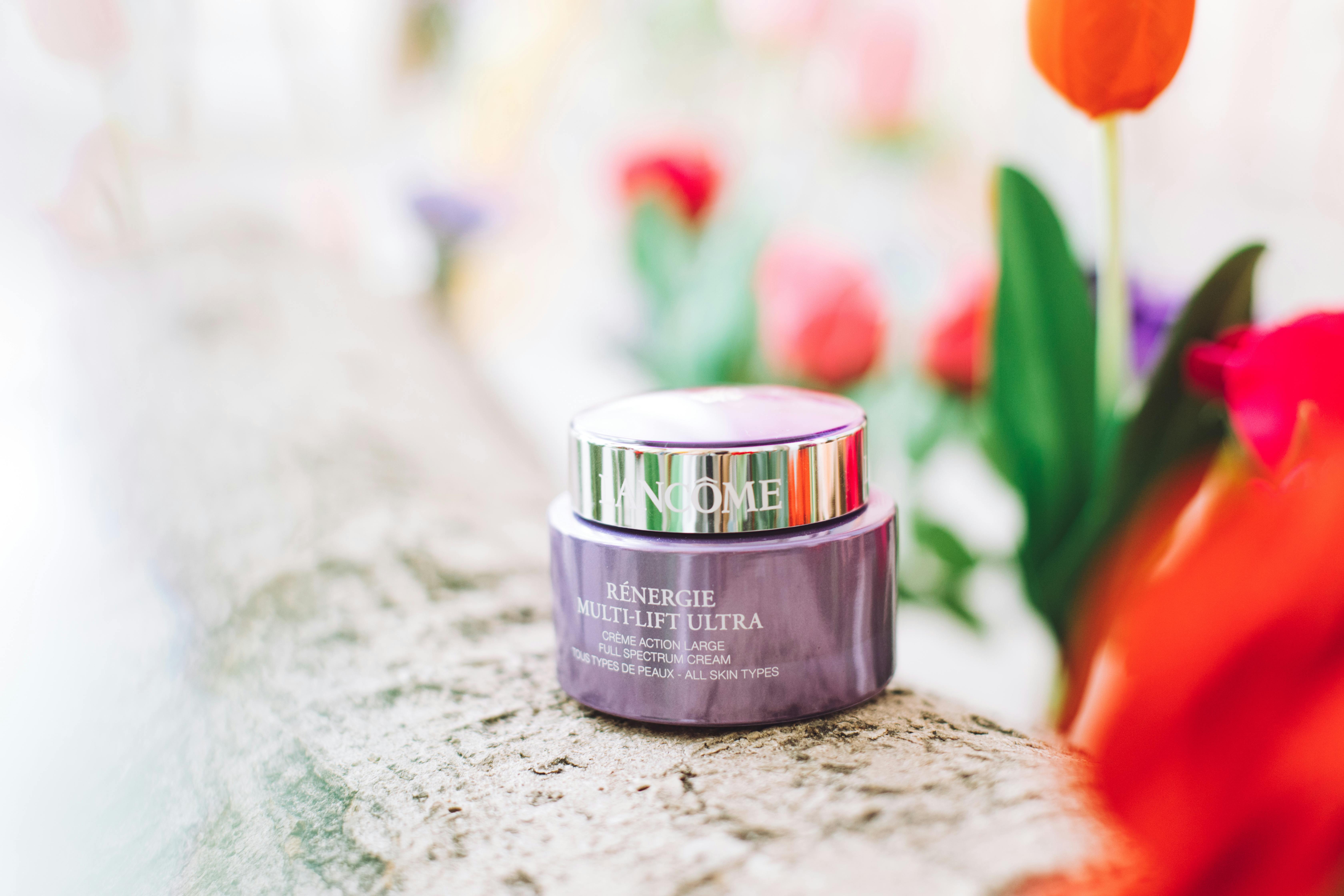 Three White Flowers on Clear Glass Bottles · Free Stock Photo