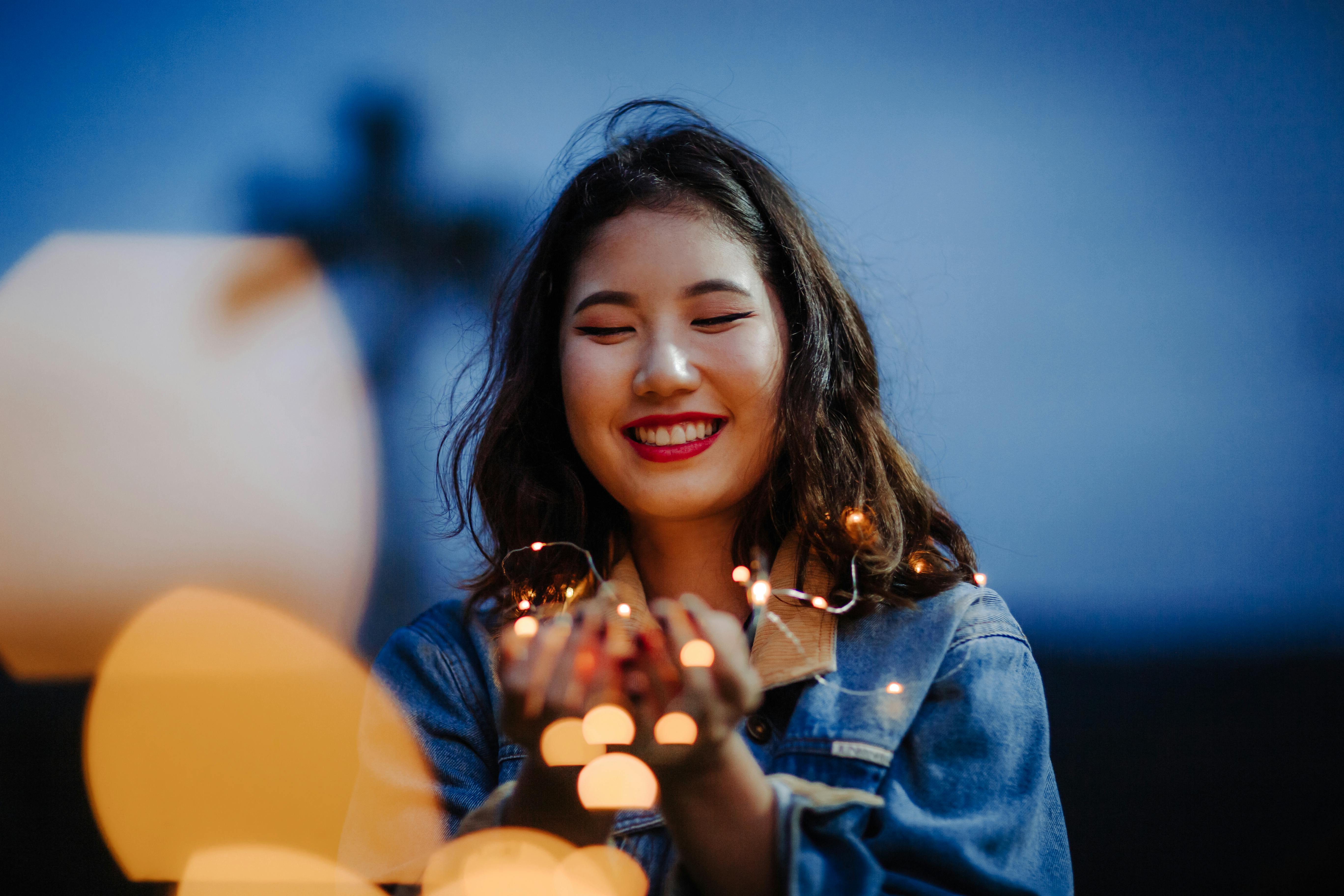 Selective Focus Photography Of Woman Holding String Lights · Free Stock ...