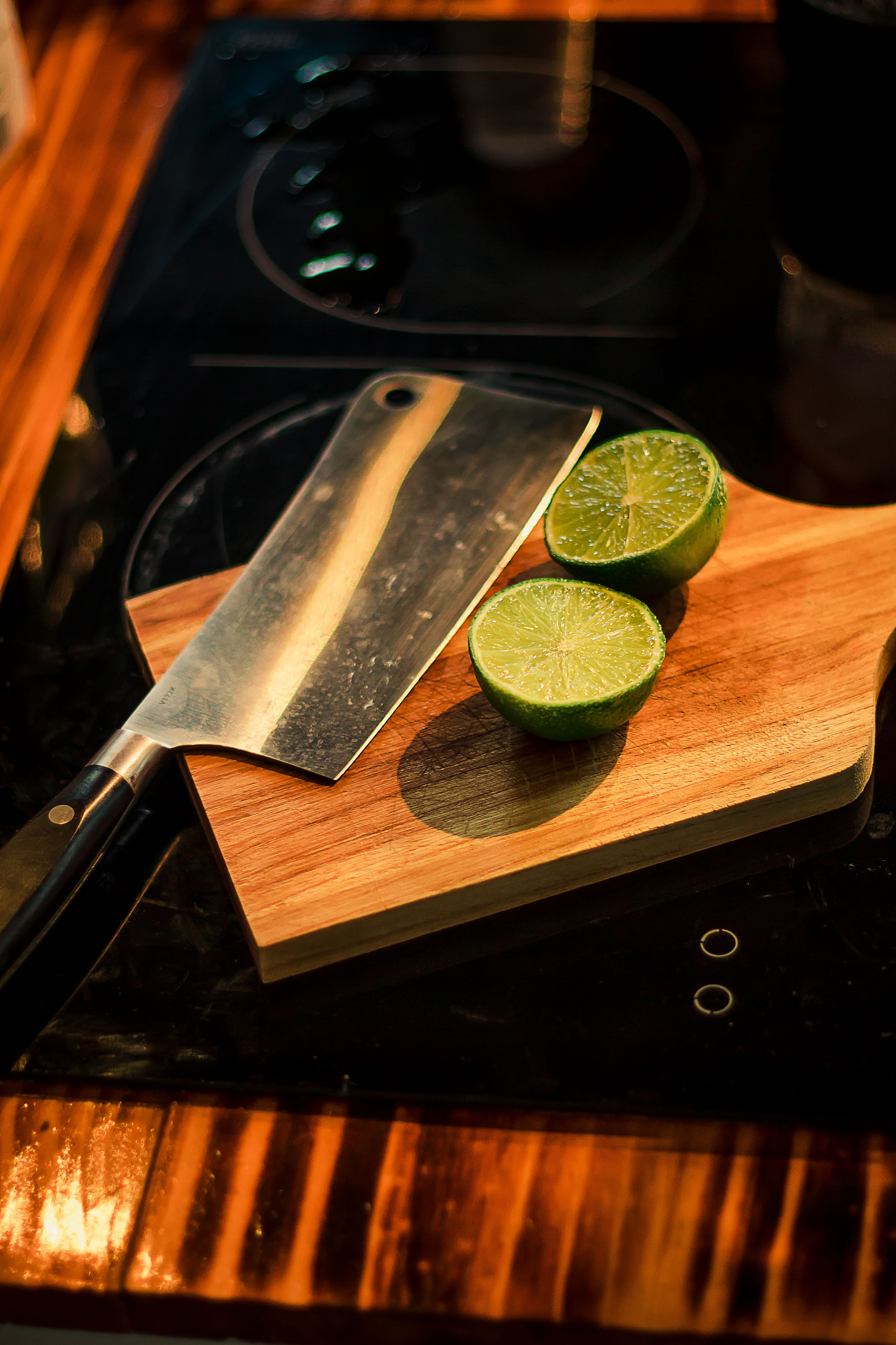 Overhead Shot of a Brown Wooden Chopping Board with Sliced Kumquats ...