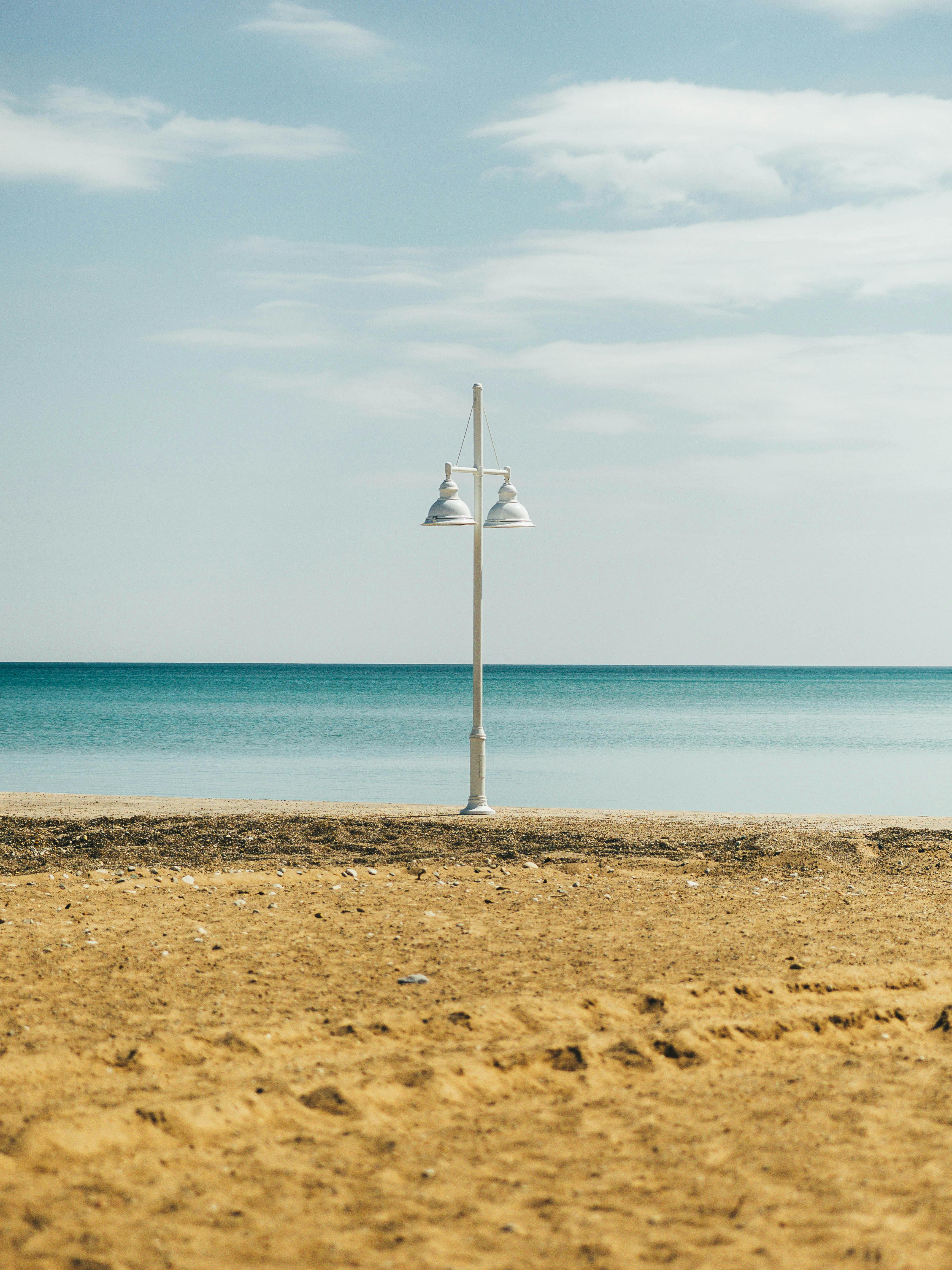 White Lamppost on Beach · Free Stock Photo