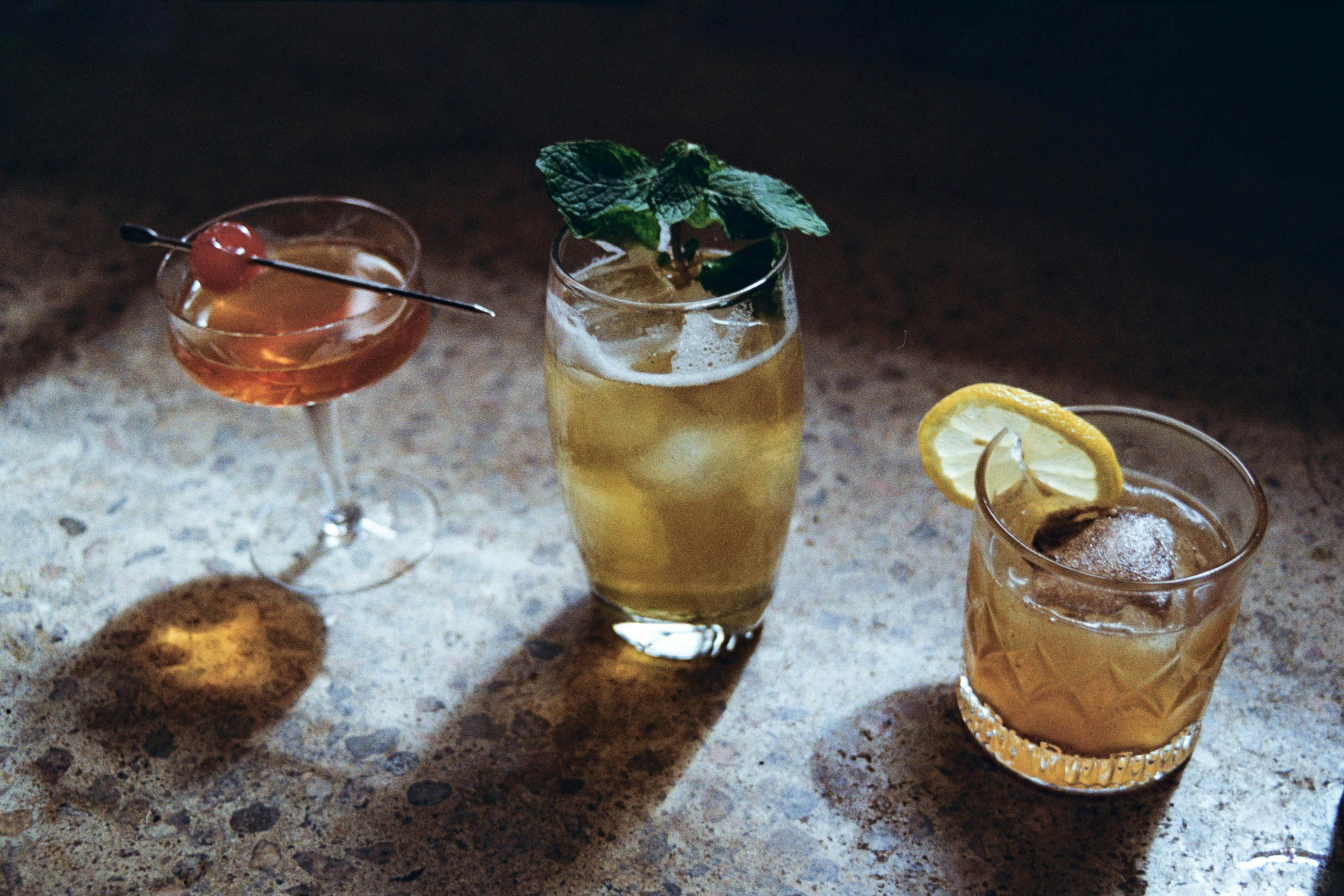 Three cocktails are shown on a table · Free Stock Photo