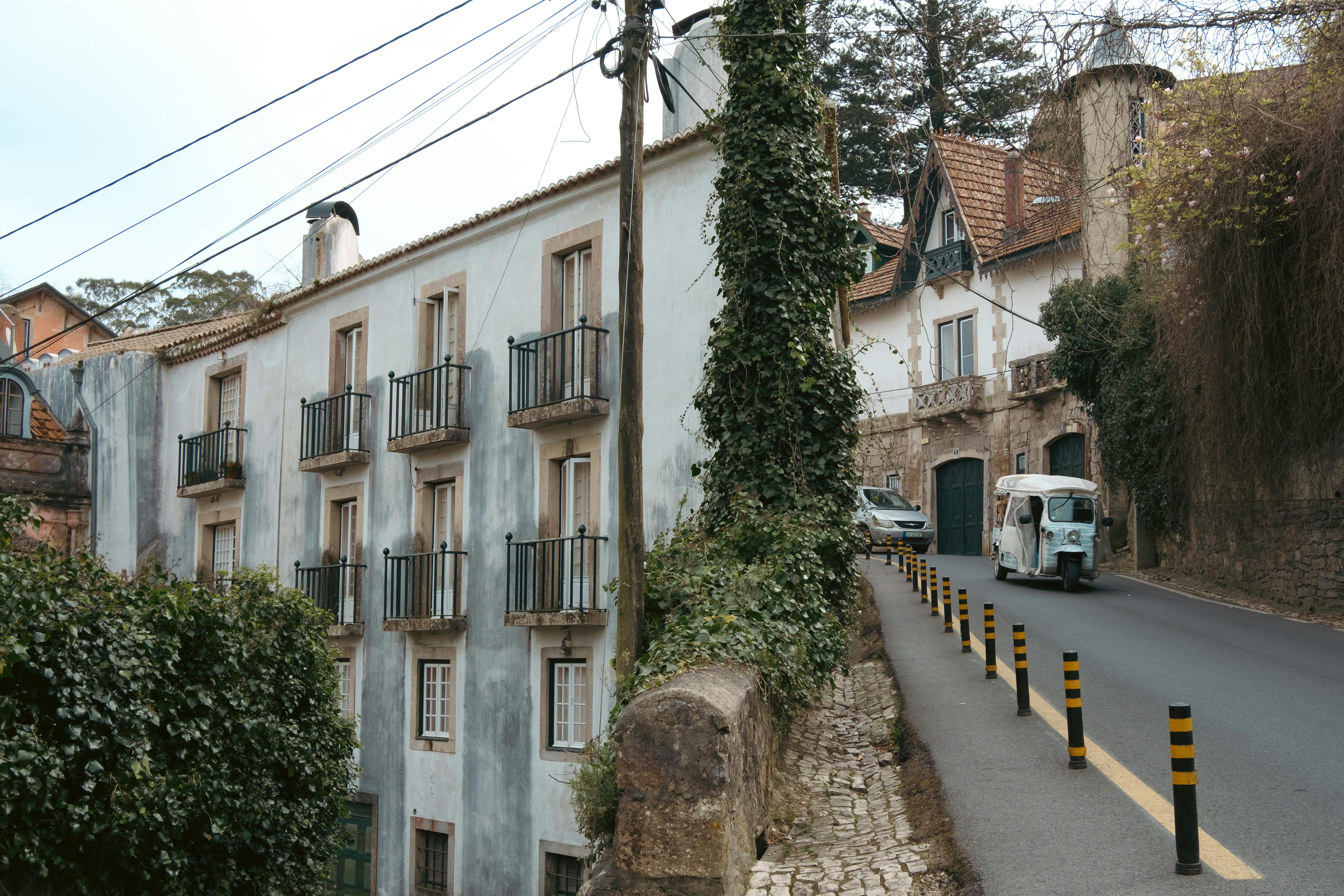 Rickshaw Driving Past a House · Free Stock Photo