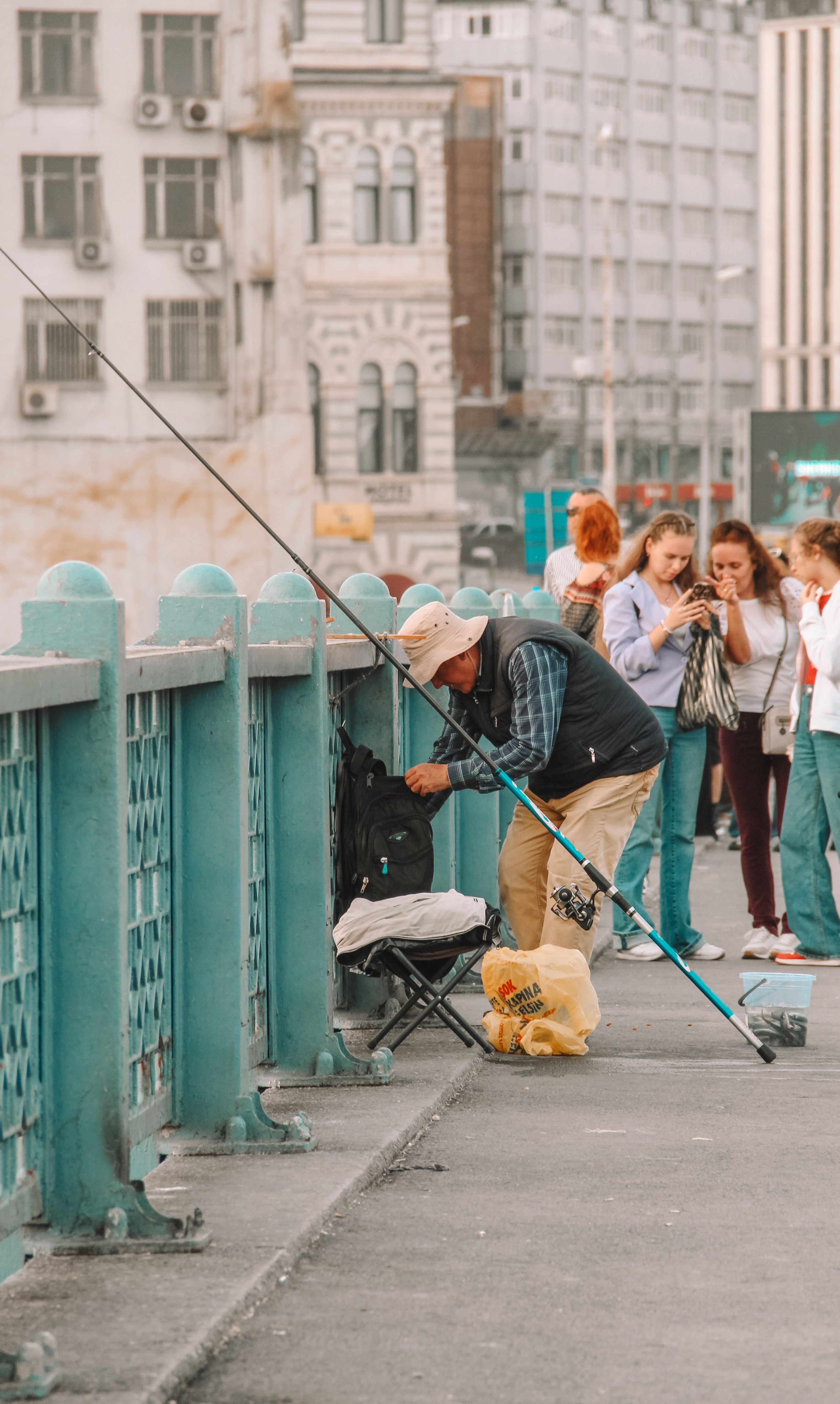 Fisherman on Bridge in City · Free Stock Photo