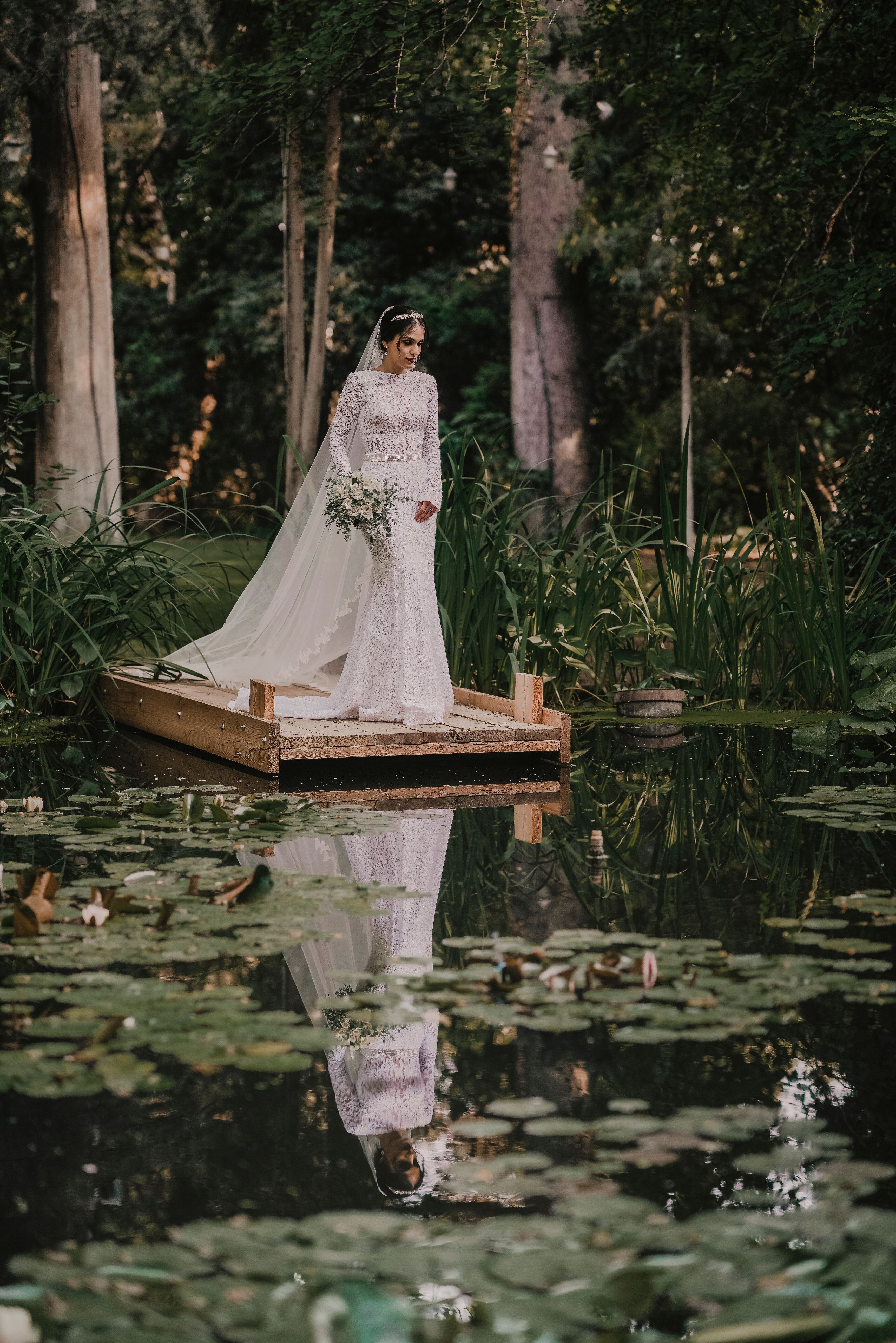 Elegant Bride on Wooden Platform by Forest Pond · Free Stock Photo
