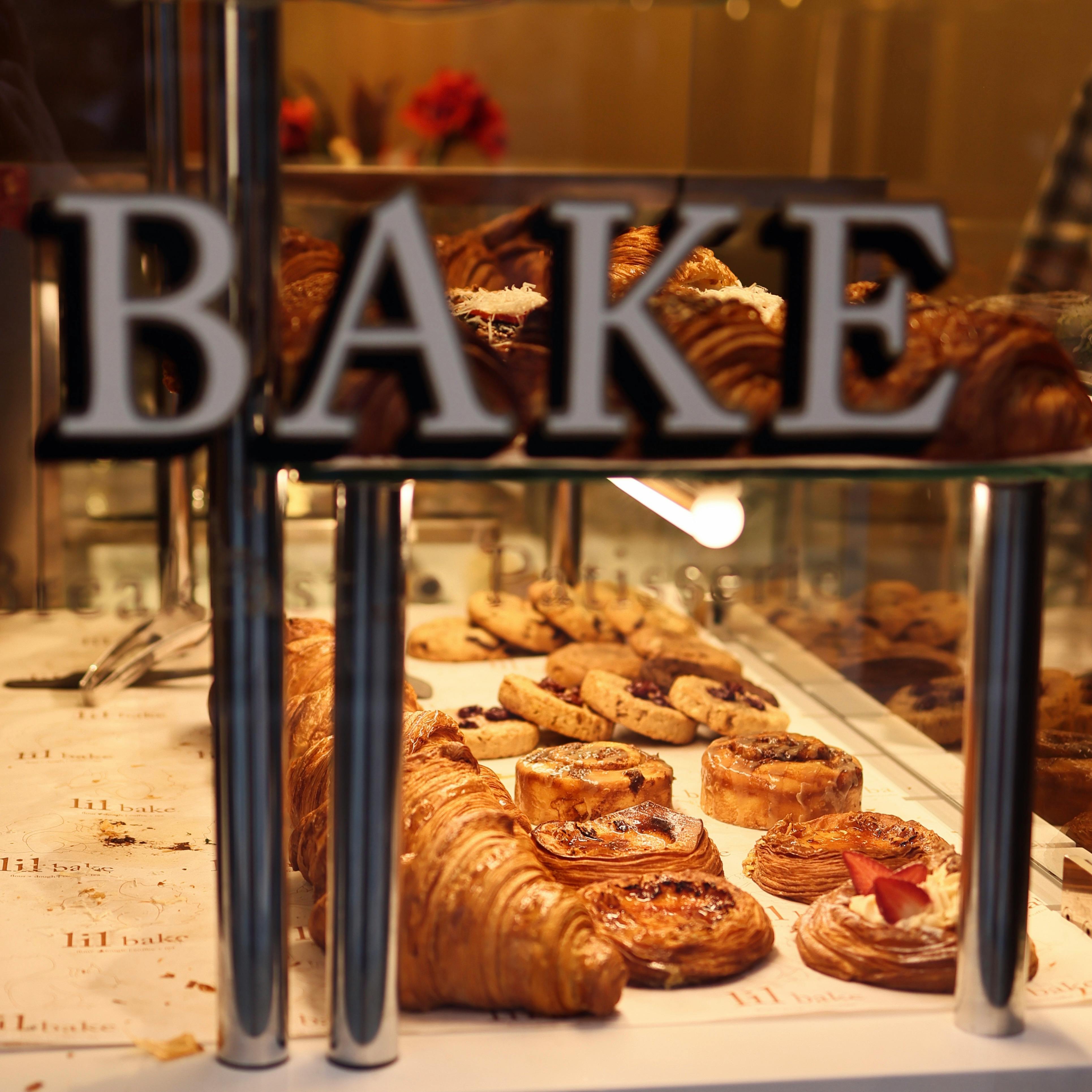 Food behind Bakery Window · Free Stock Photo