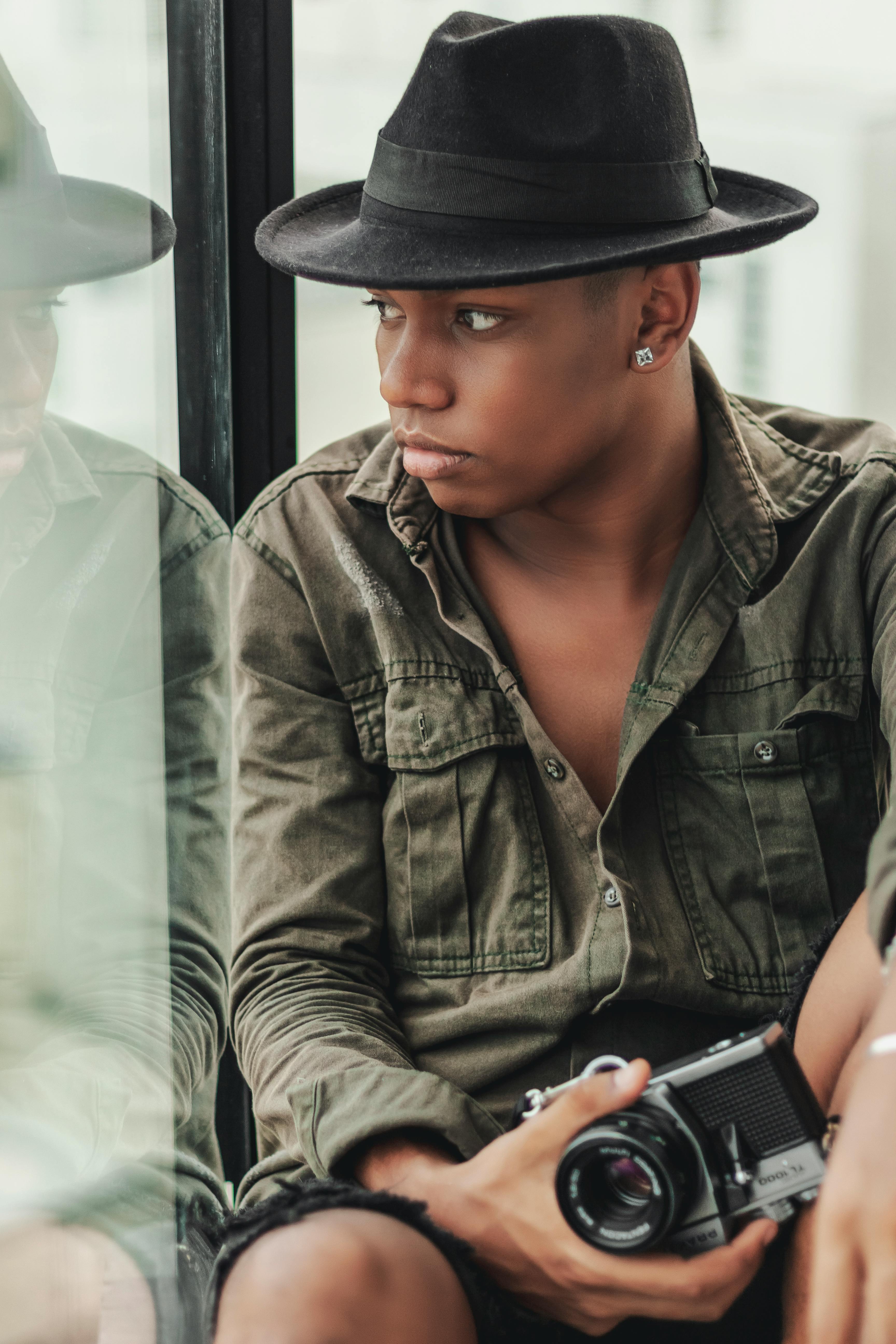 Man Wearing Dress Shirt and Holding Camera · Free Stock Photo
