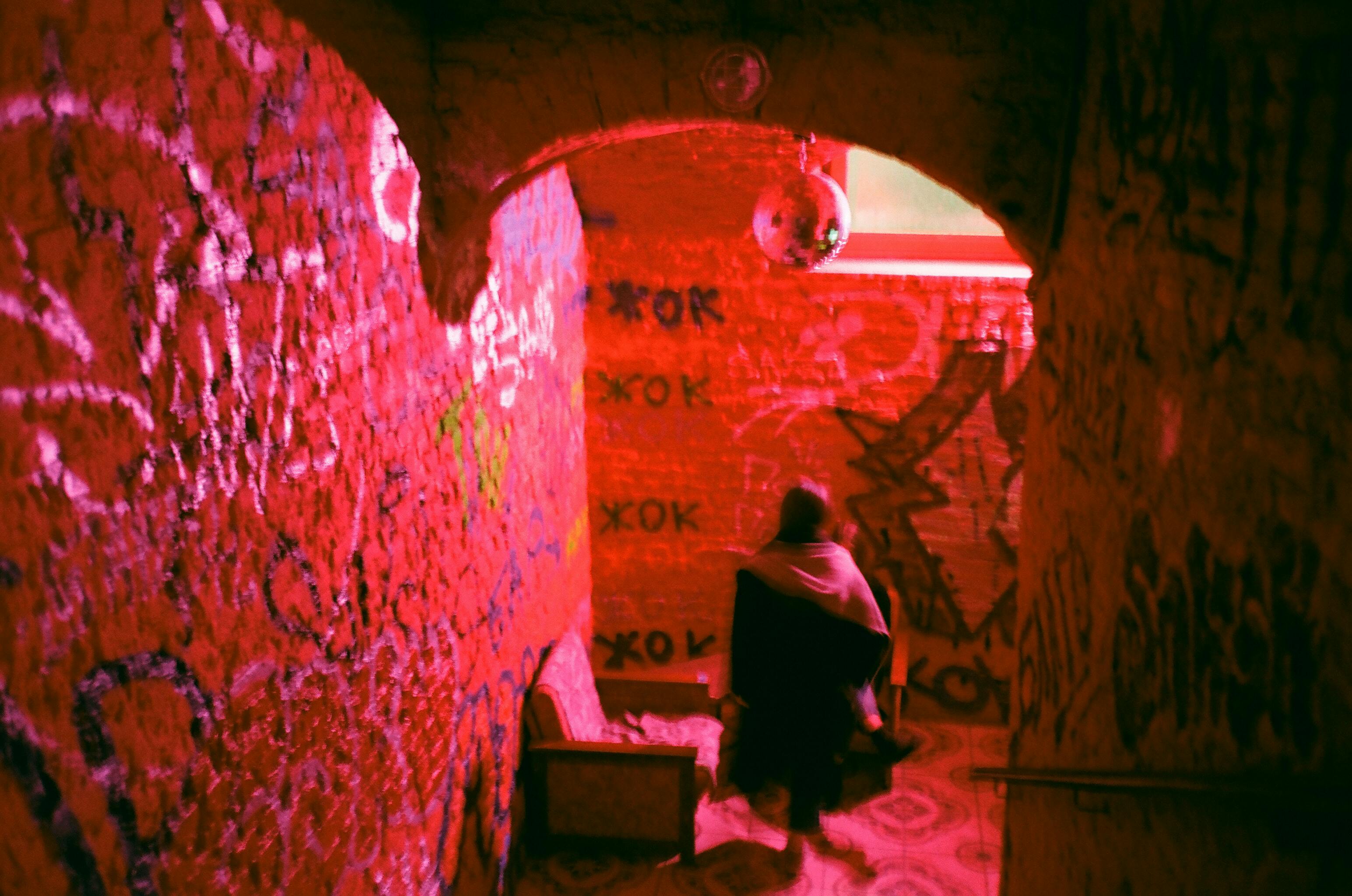 Person Standing in Between Walls · Free Stock Photo