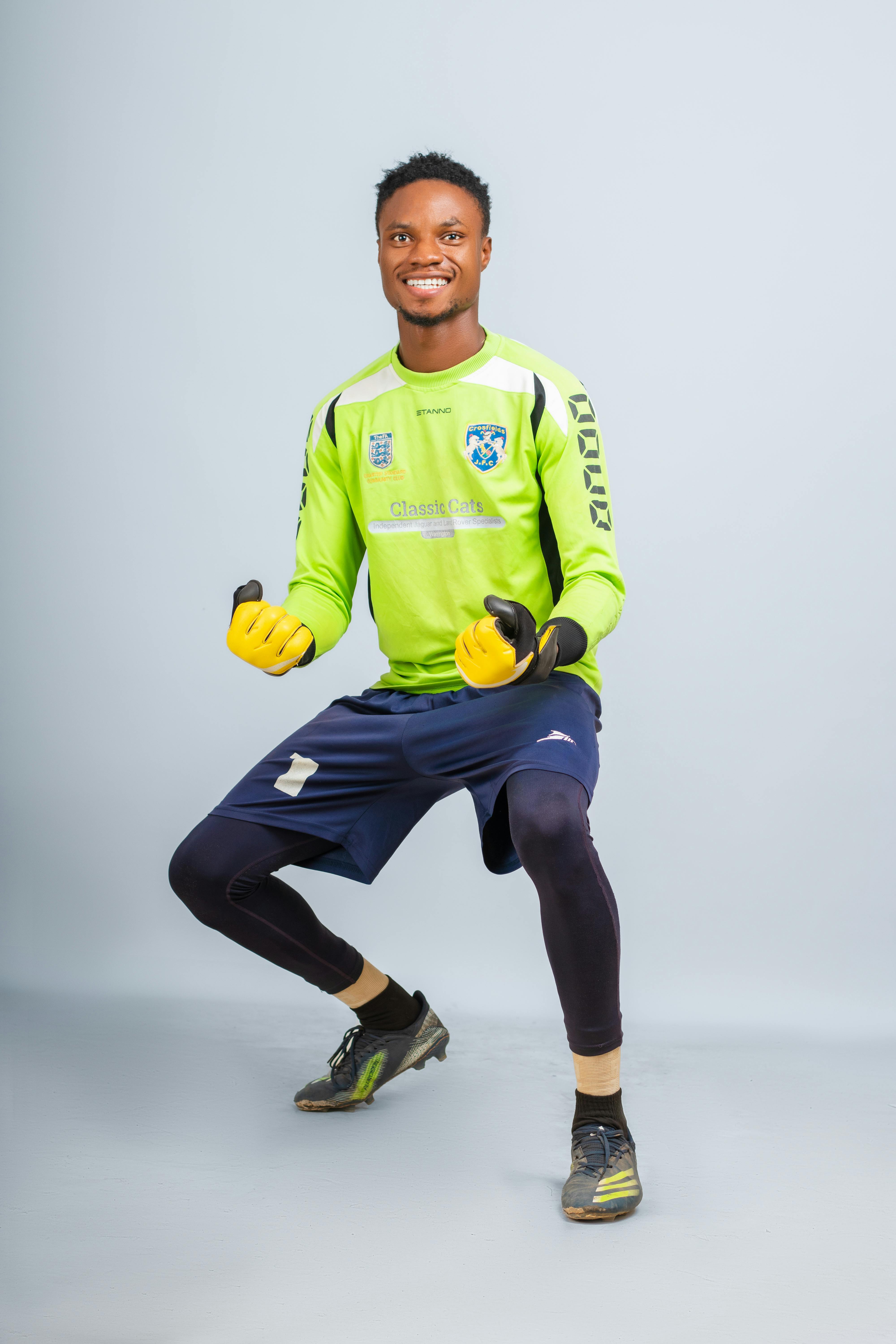 Goalkeeper Posing in a Studio · Free Stock Photo