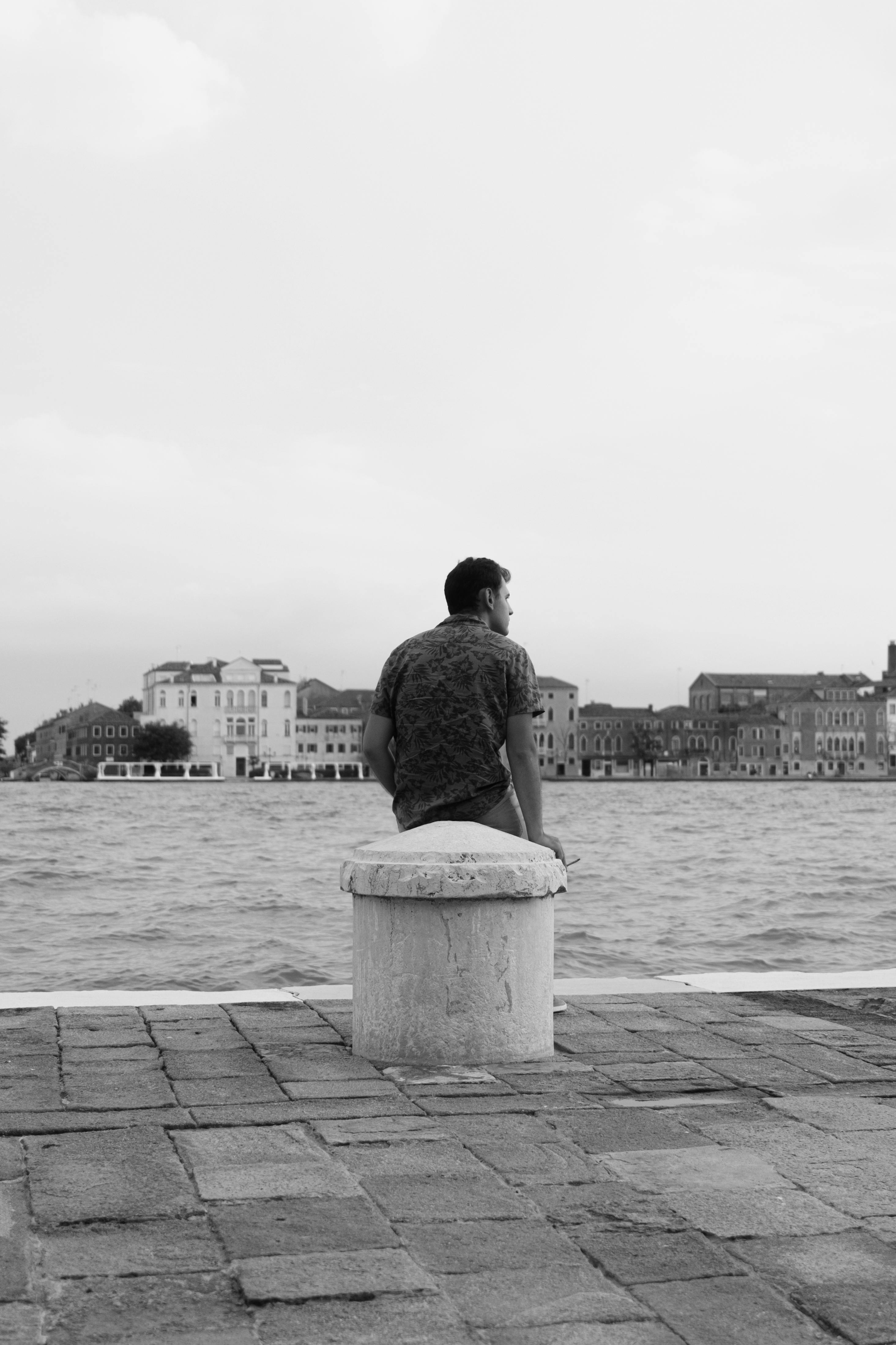 Man taking a smoke break in Venice · Free Stock Photo
