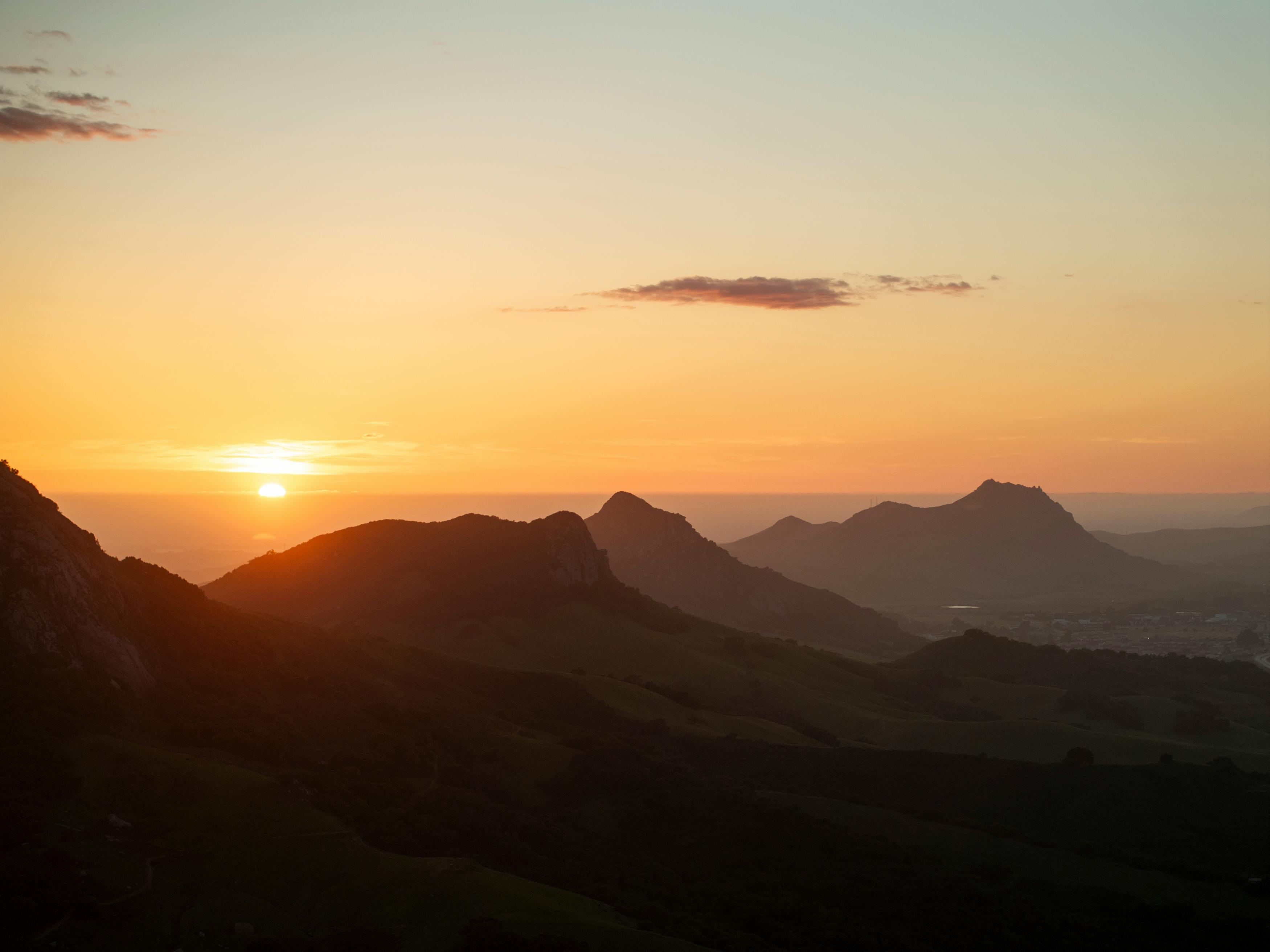 Silhouette of Hills at Sunset · Free Stock Photo