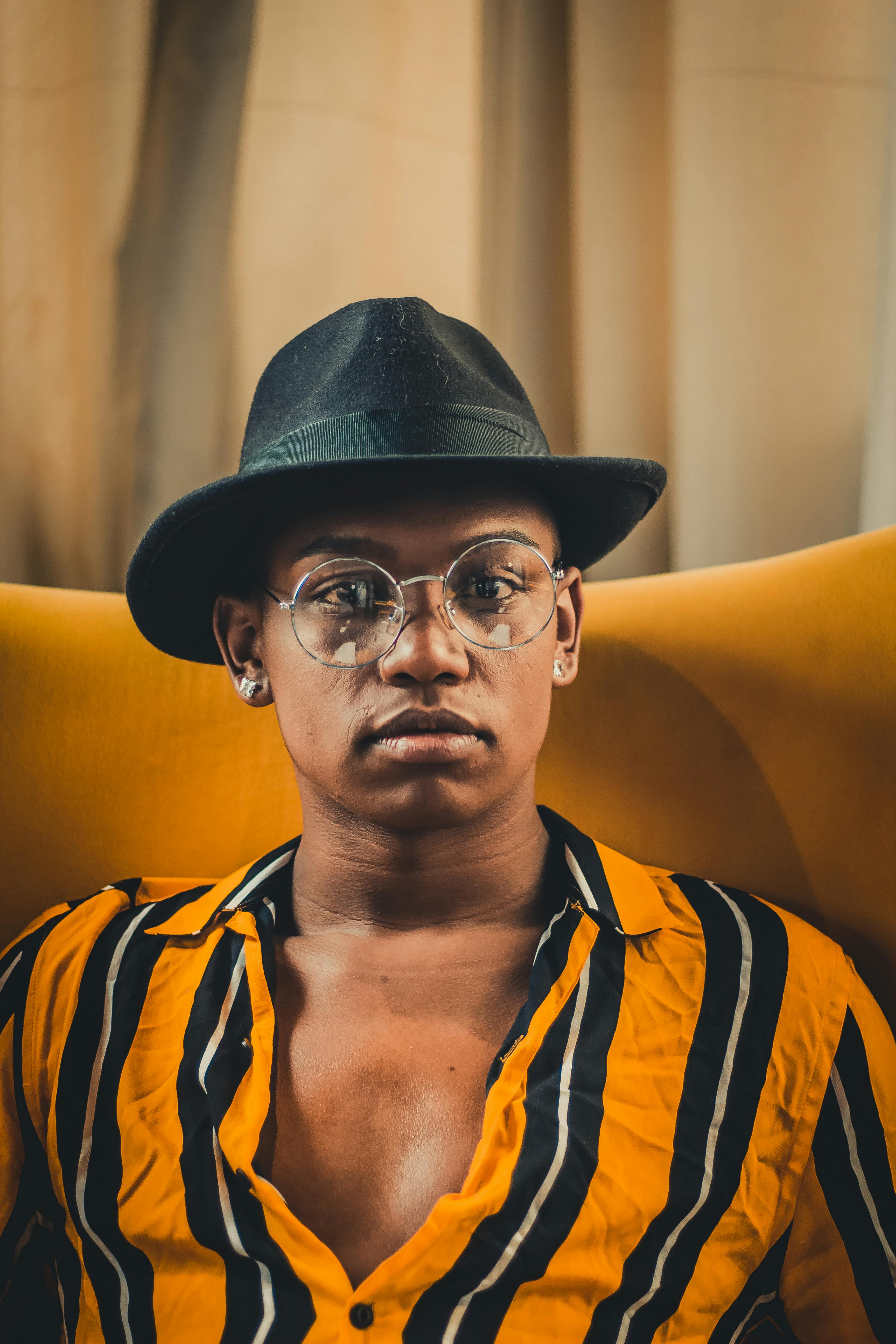 Man Sitting On Yellow Chair · Free Stock Photo