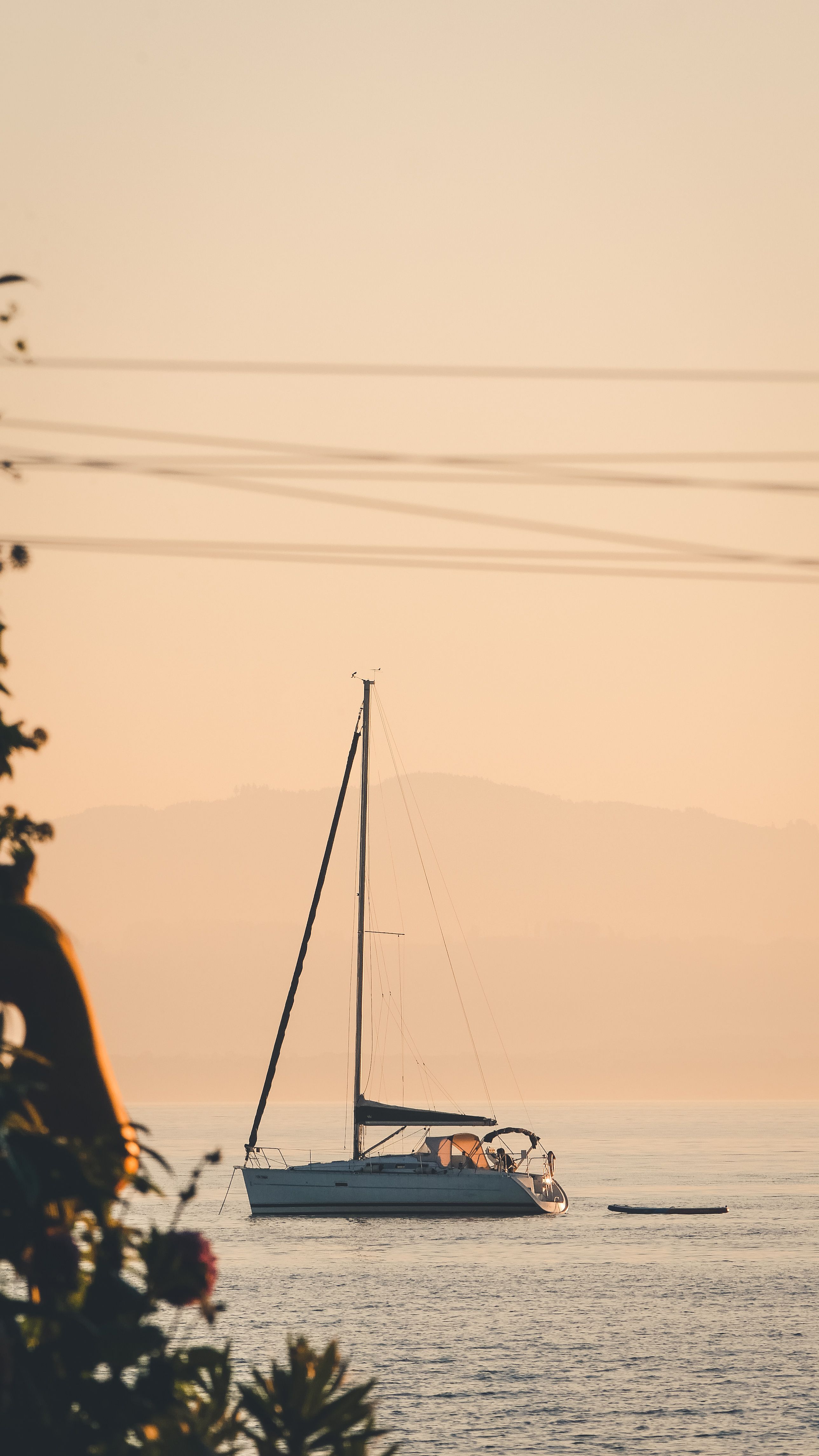 Sailboat on Coast at Sunset · Free Stock Photo