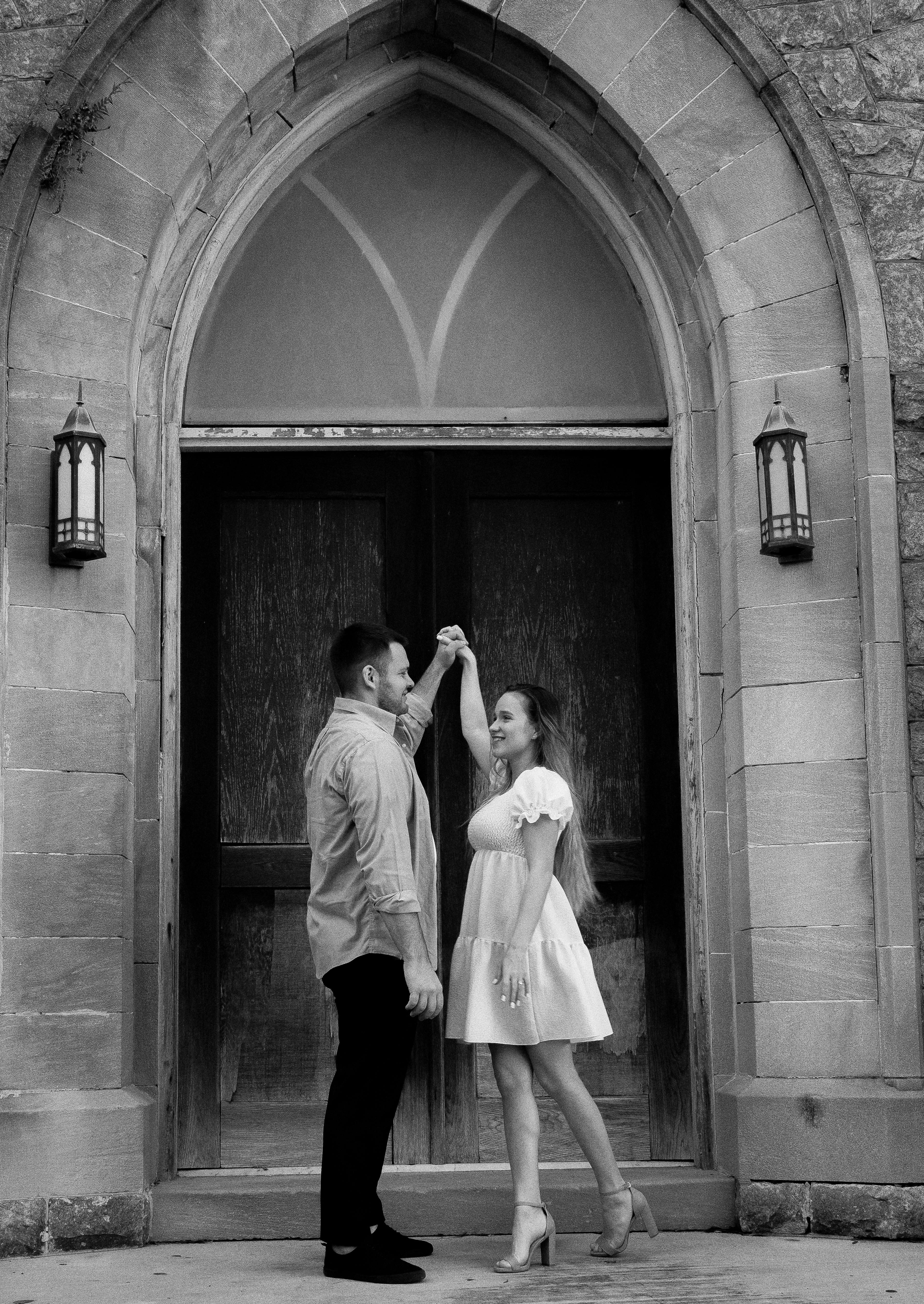 Couple Dancing in front of a Medieval Doorway · Free Stock Photo