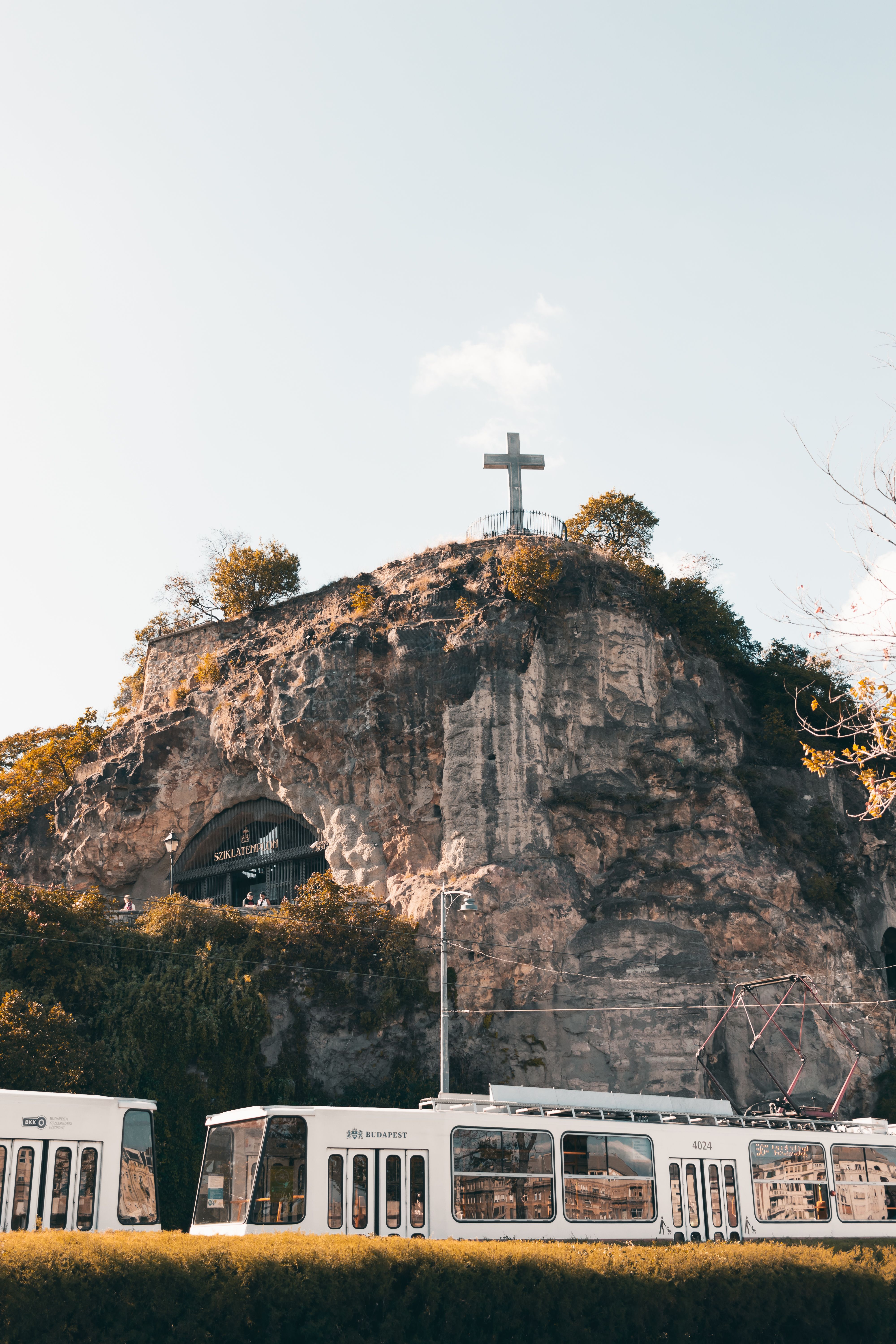 Hilltop Cross with a Tramway in the Foreground · Free Stock Photo