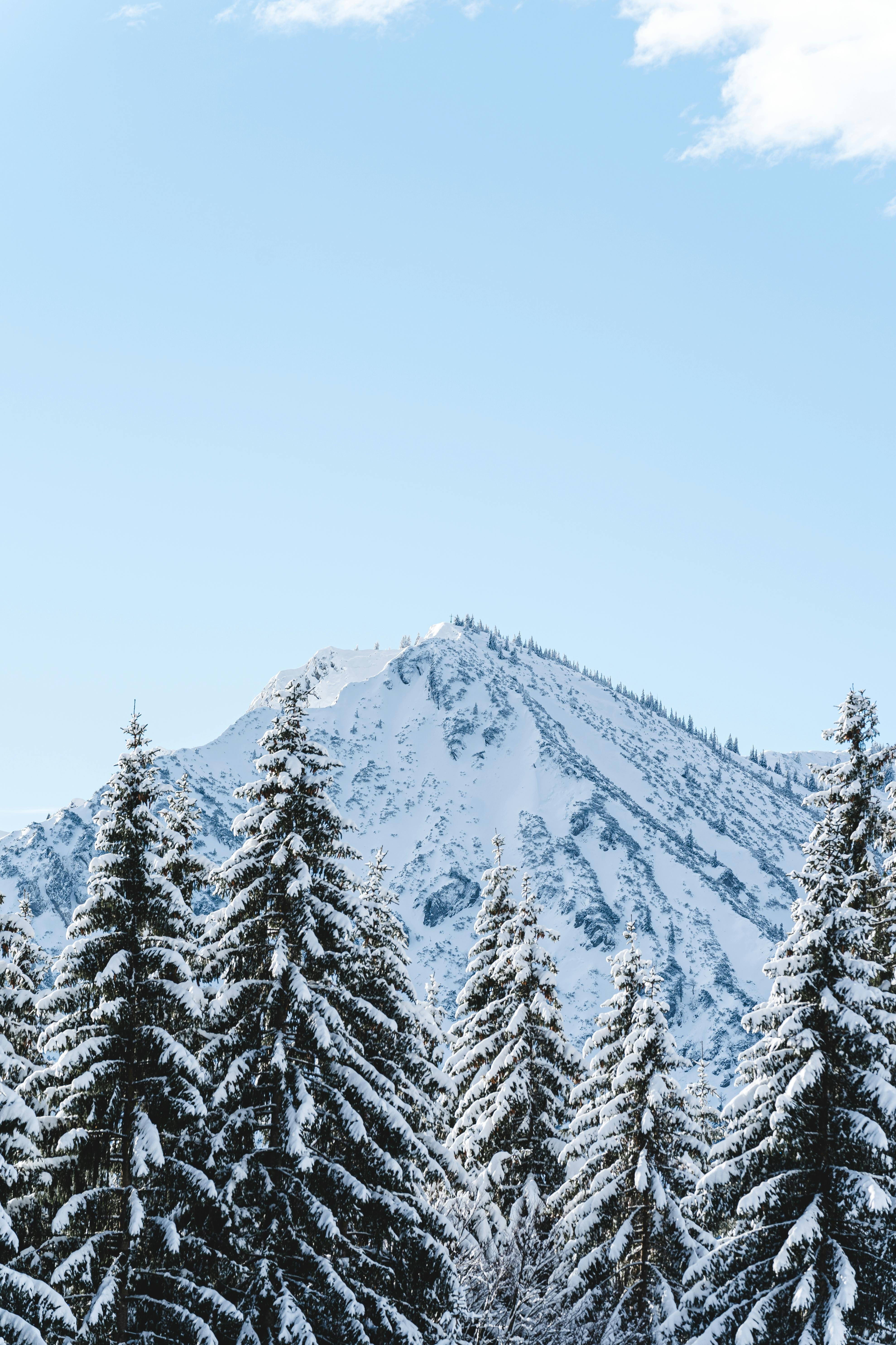 Scenic View of Mountains Covered with Snow · Free Stock Photo