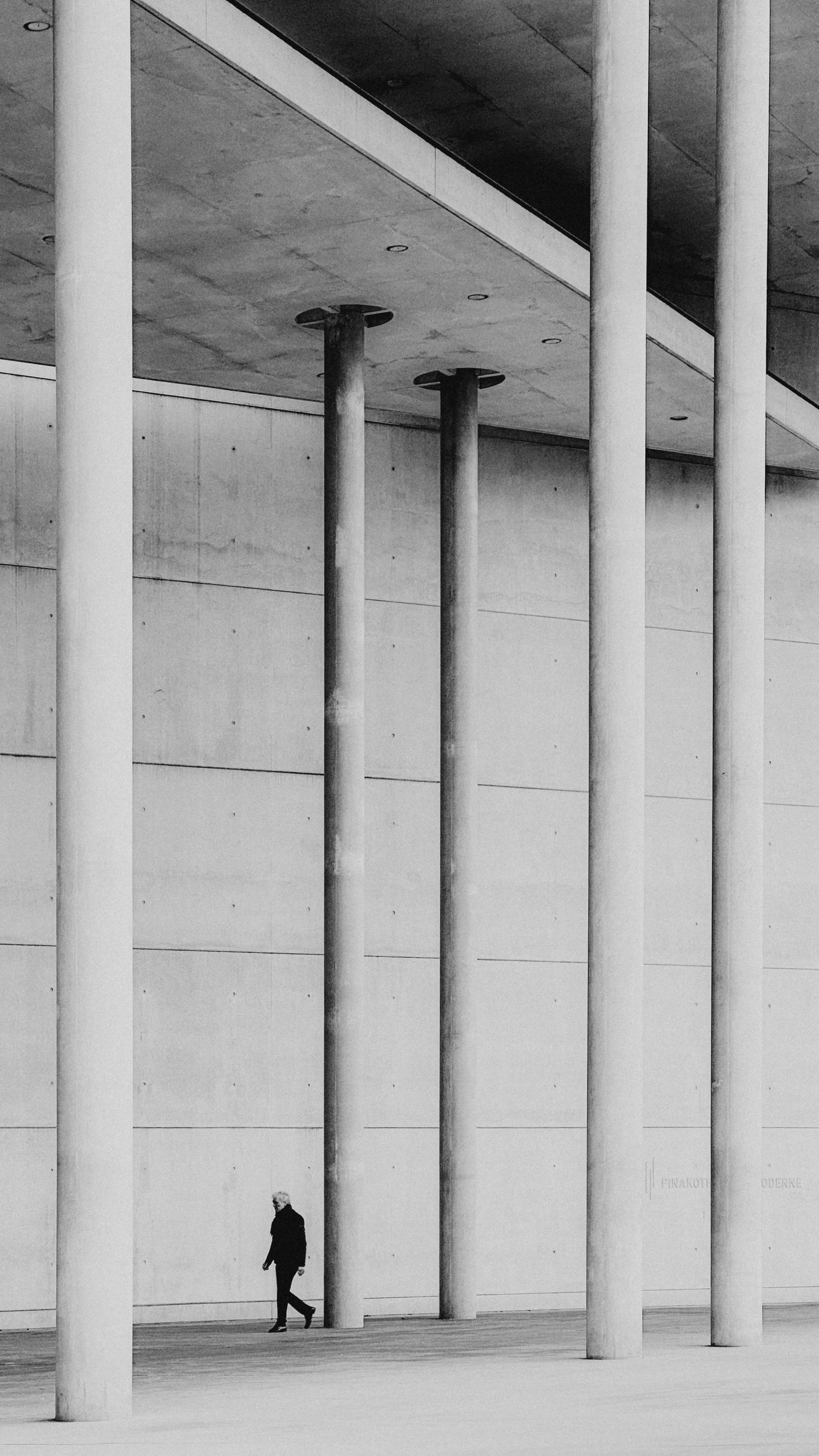 Passerby by the Tall Columns of the Modern Art Museum in Munich · Free ...