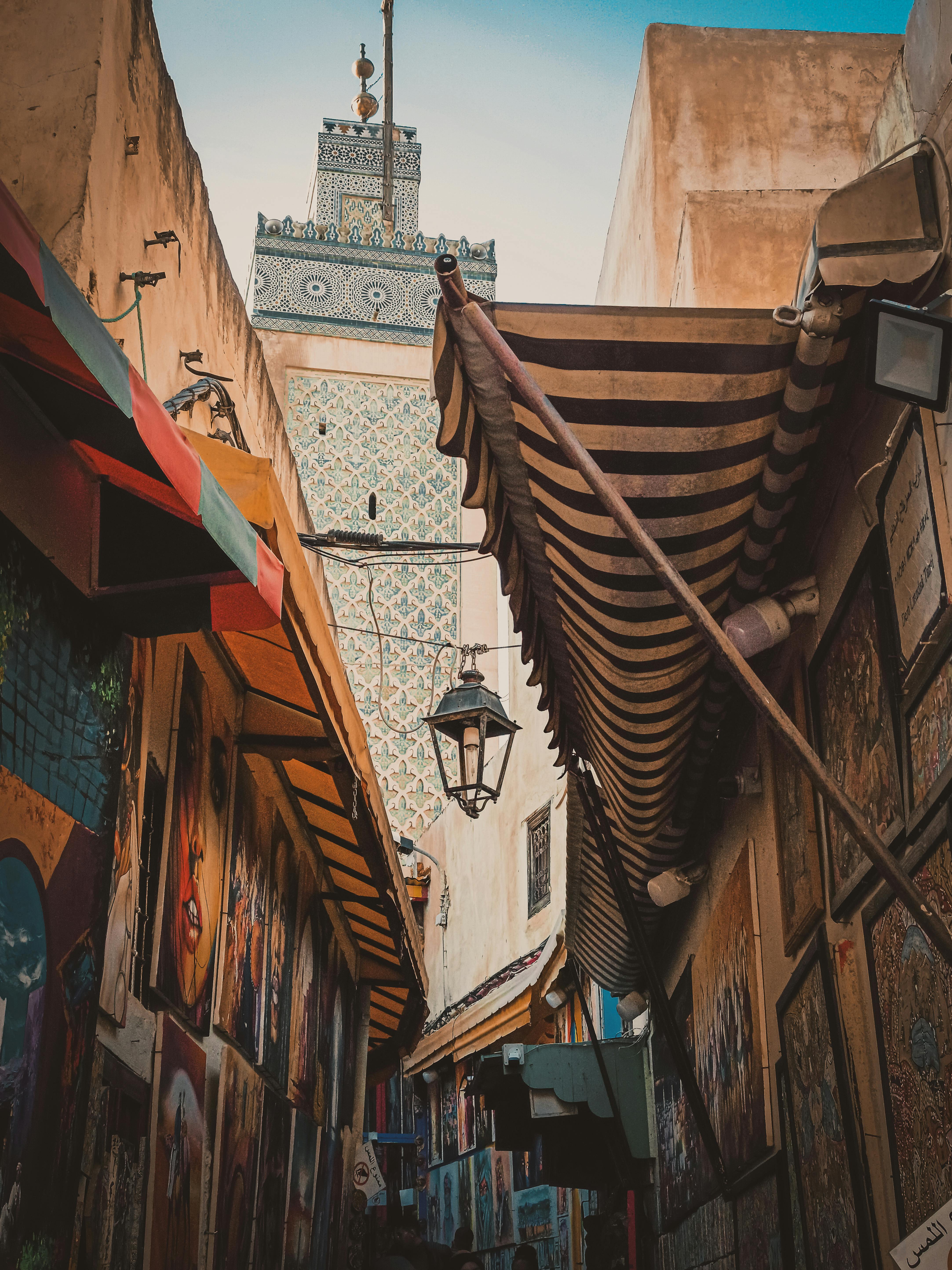 Alley in Fes with a Tower of the Bou Inania Madrasa in the Background ...