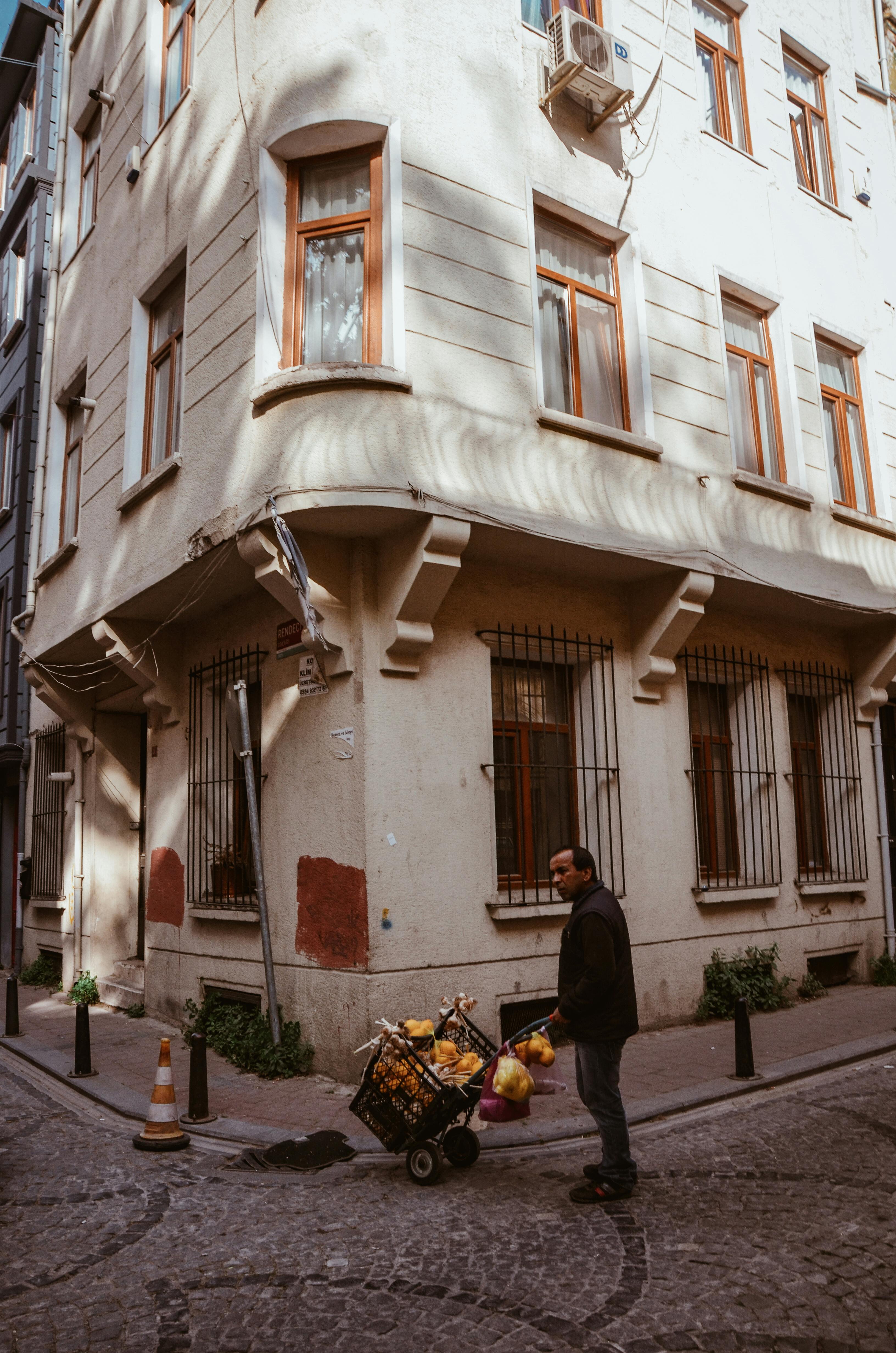 Man Standing Near Building · Free Stock Photo
