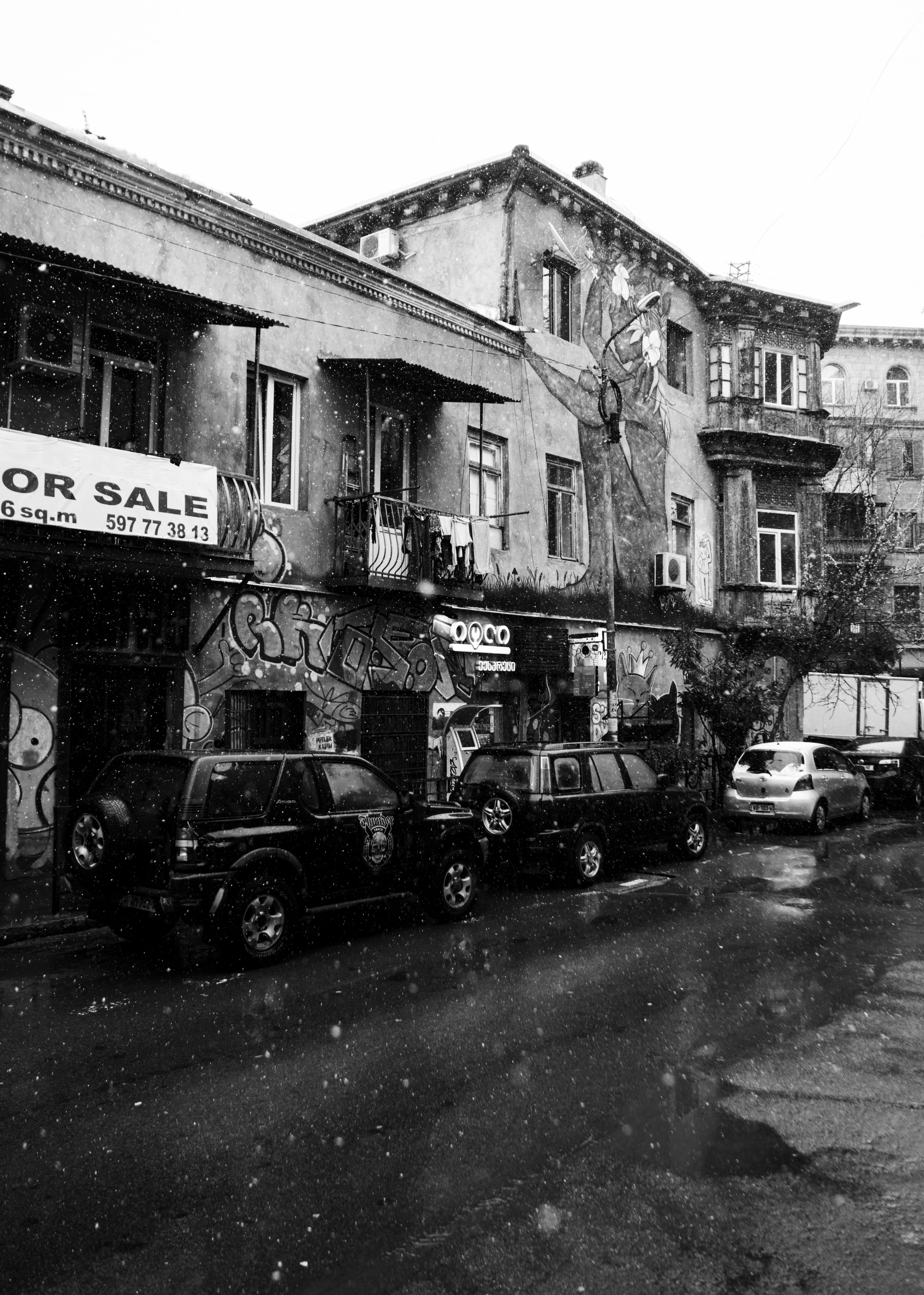 Apartment Building with Mural in the Rain · Free Stock Photo