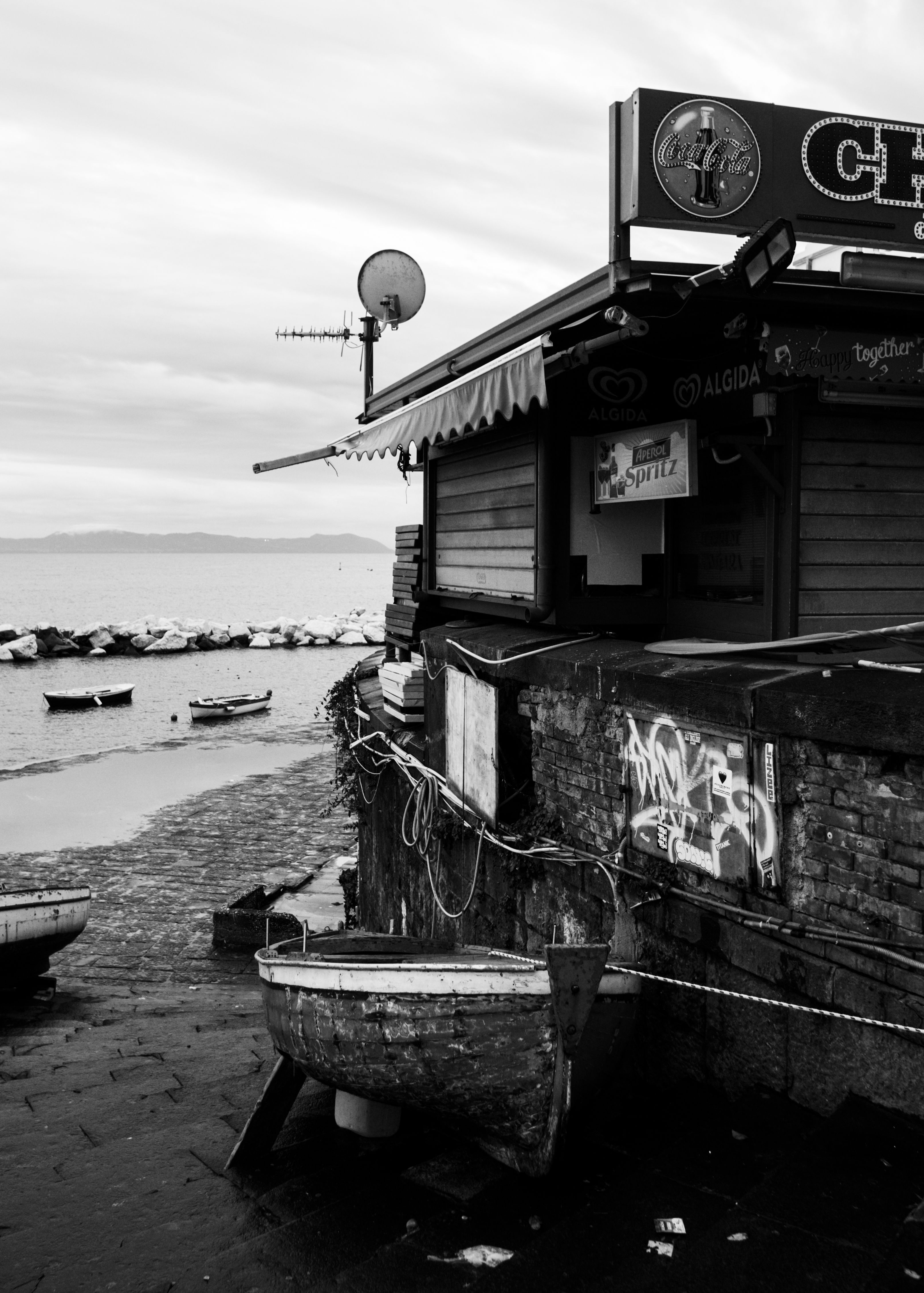 Boat and Building on Sea Shore · Free Stock Photo