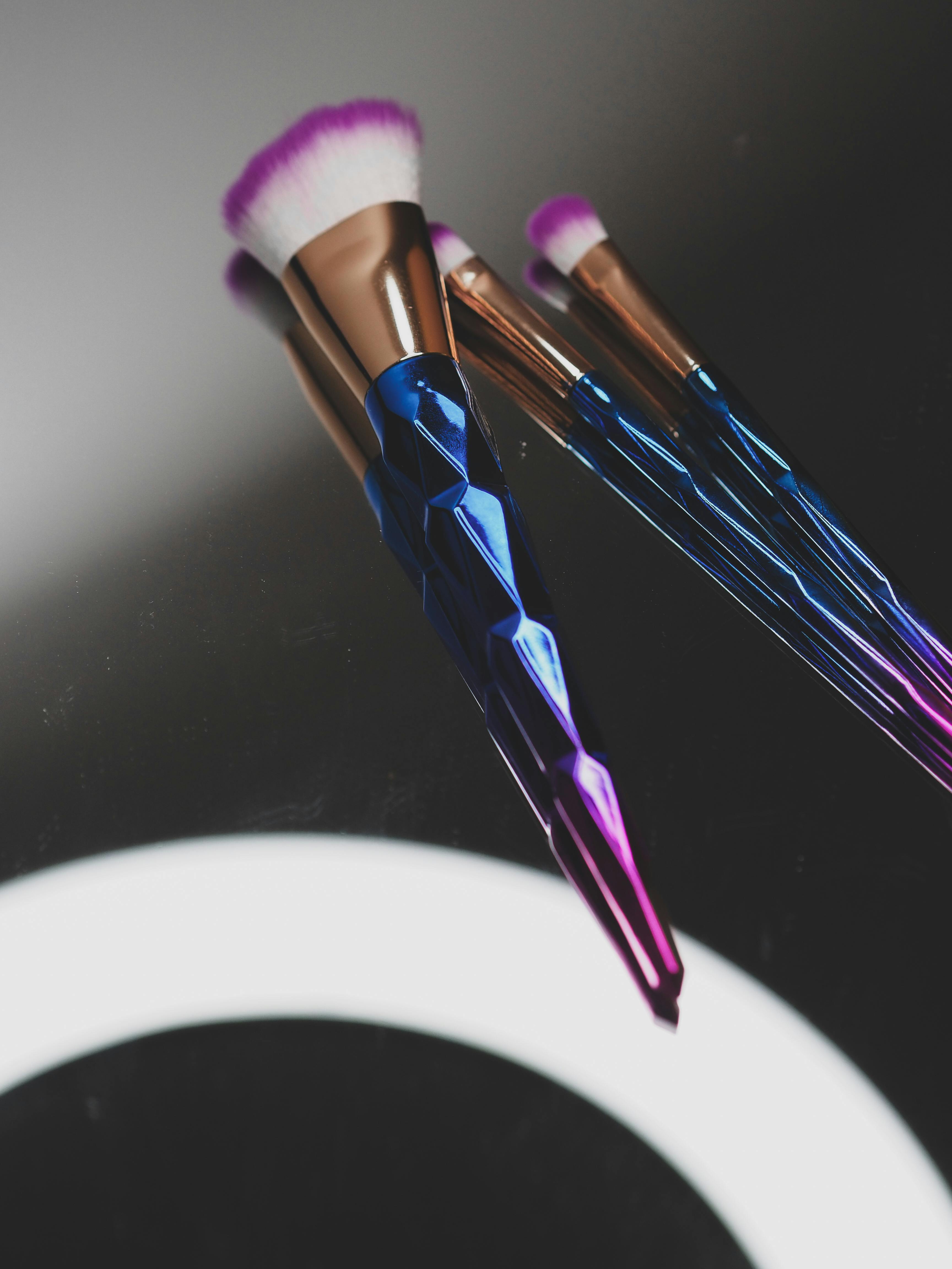 Makeup Brushes on Mirroring Surface · Free Stock Photo