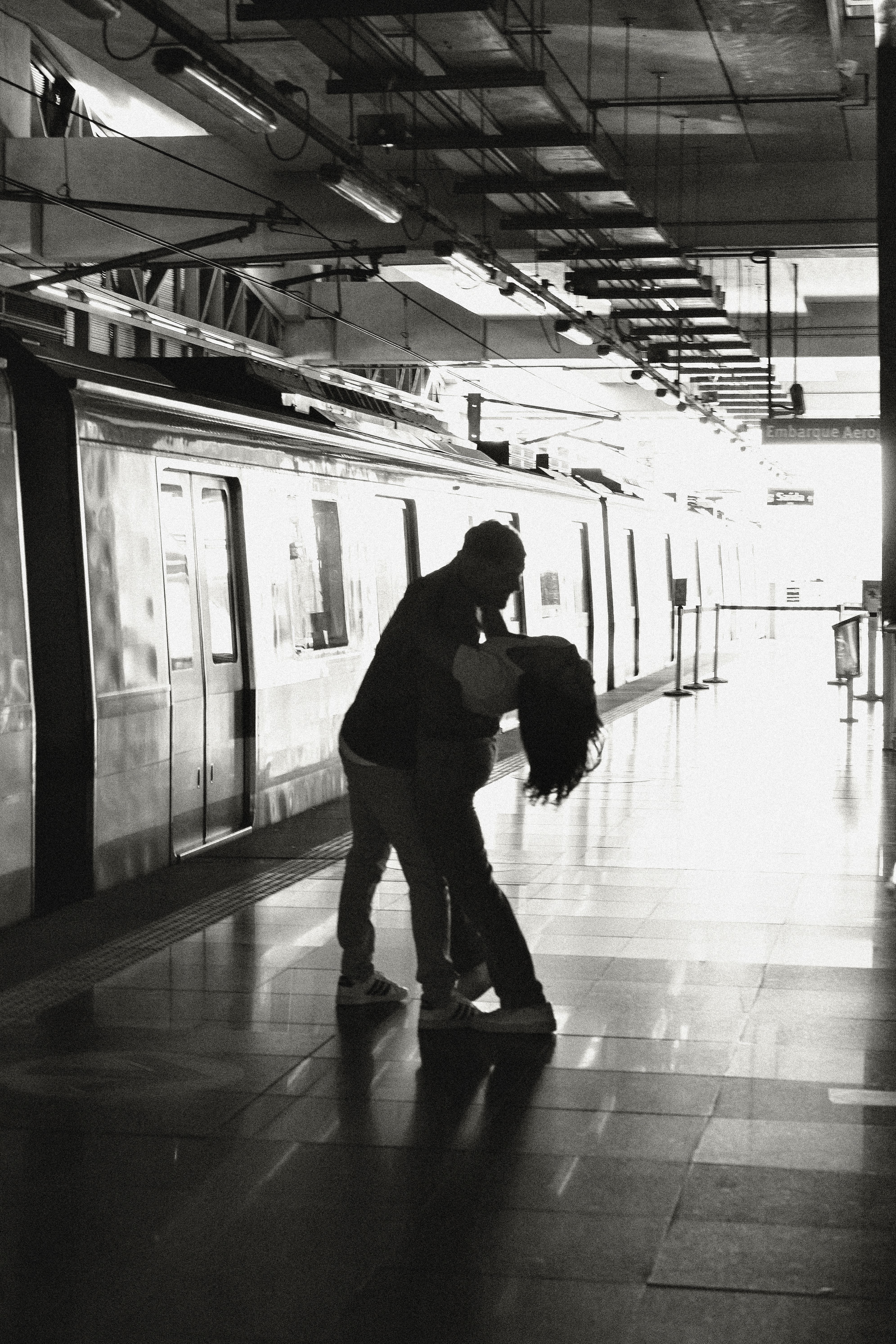 Lovely Couple Hugging at the Train Station · Free Stock Photo