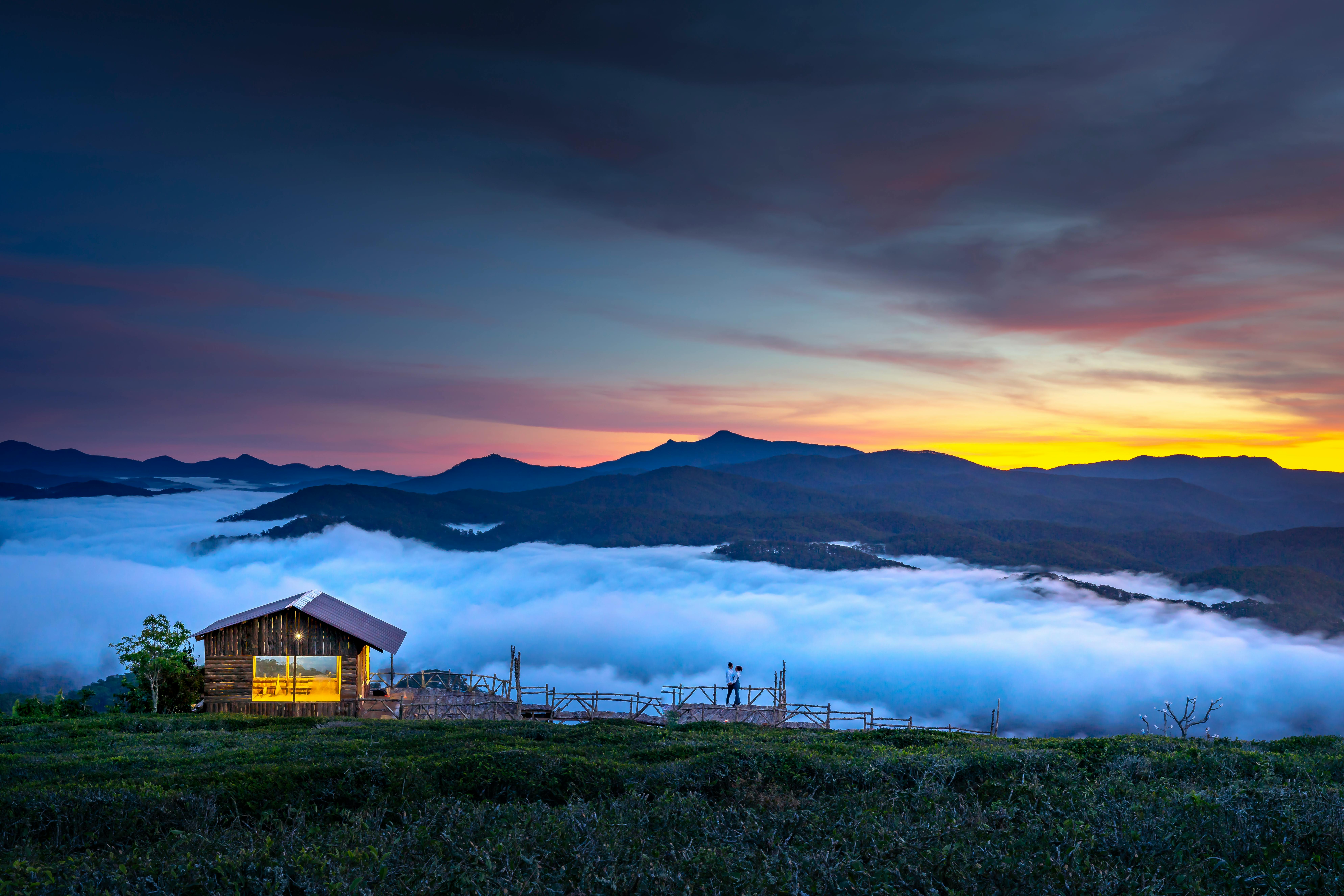 Brown Wooden Cottage With View Of Clouds And Mountain · Free Stock Photo