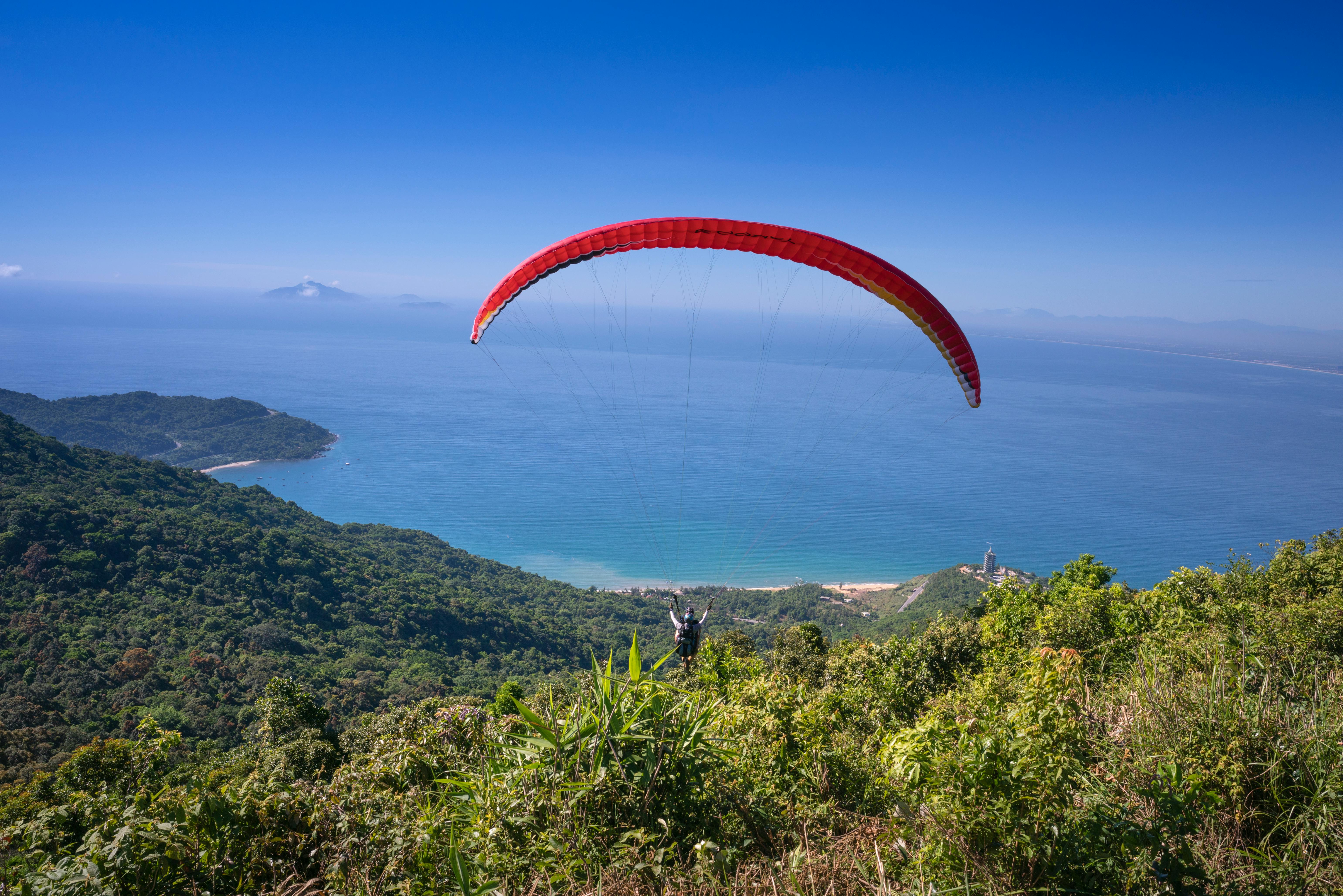 Panorama Photo of a Person Parachuting Above Volcano Lake during ...