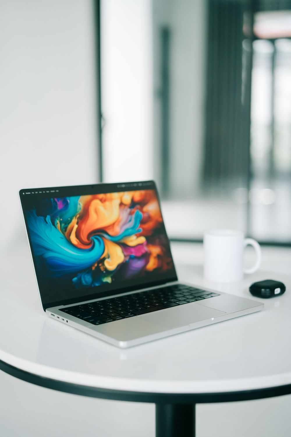 Laptop on a White Table · Free Stock Photo