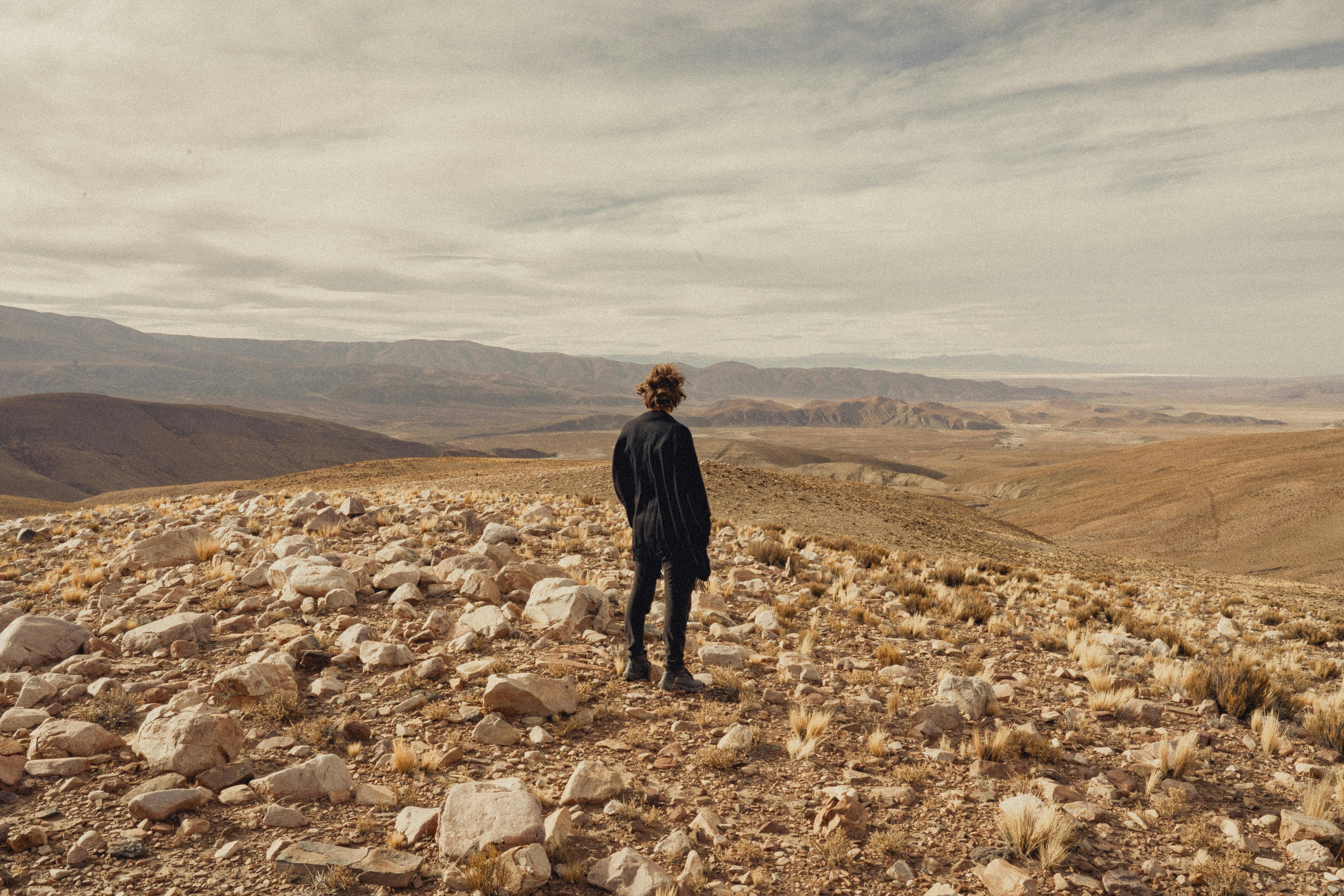 Man Standing on Hill in Countryside · Free Stock Photo