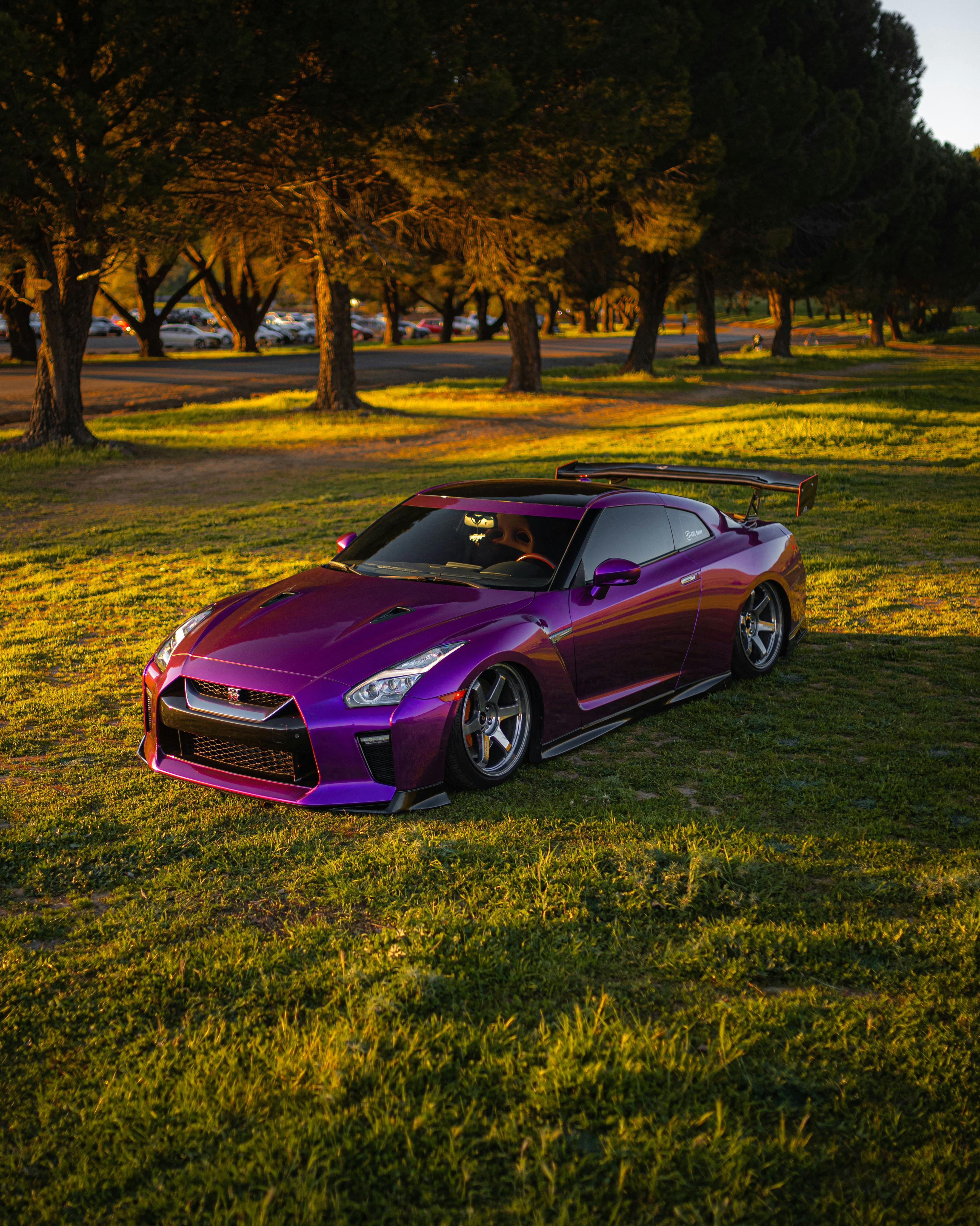 Purple Nissan GT-R Parked on Grass · Free Stock Photo