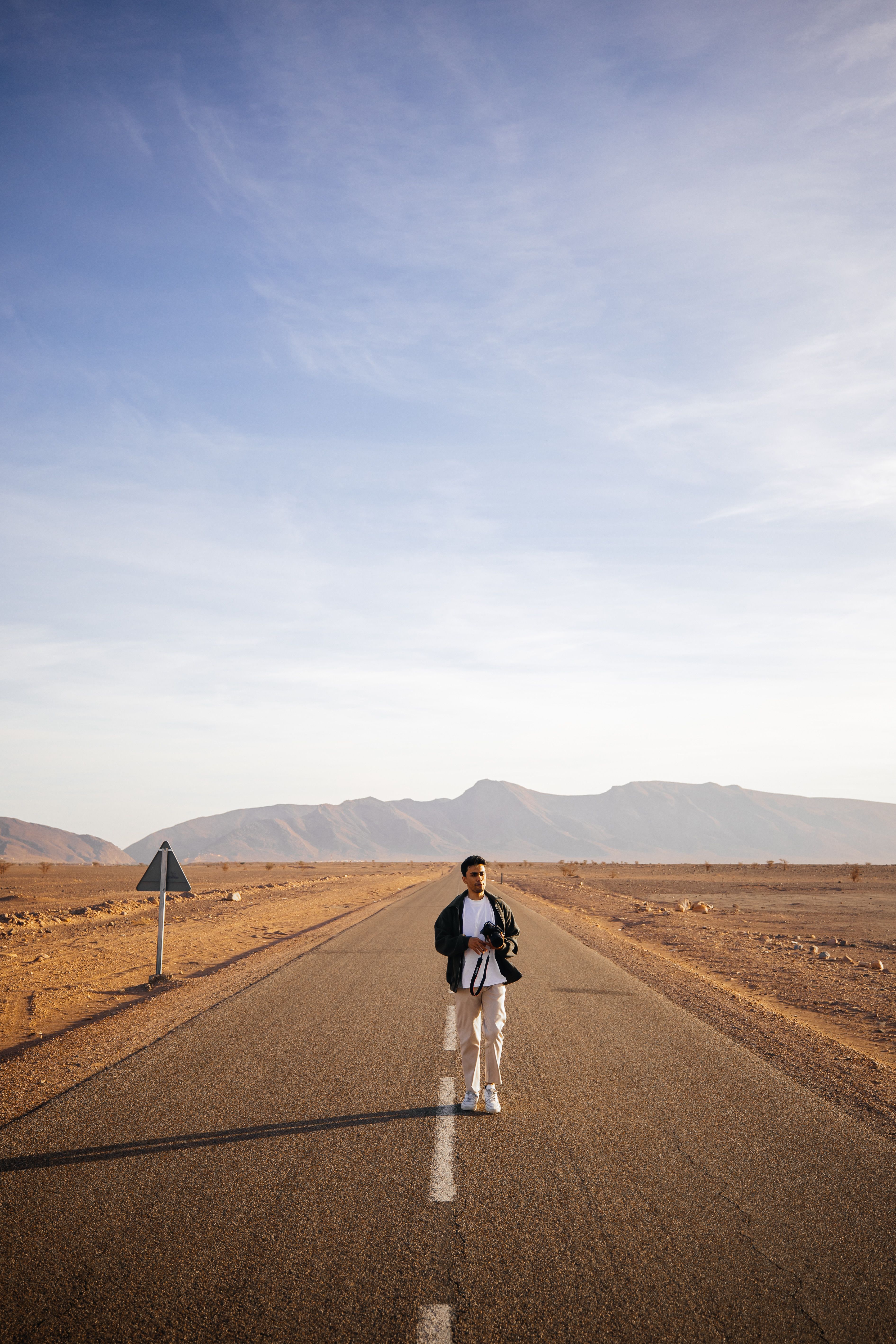 Man with Camera Walking on Road in Utah · Free Stock Photo