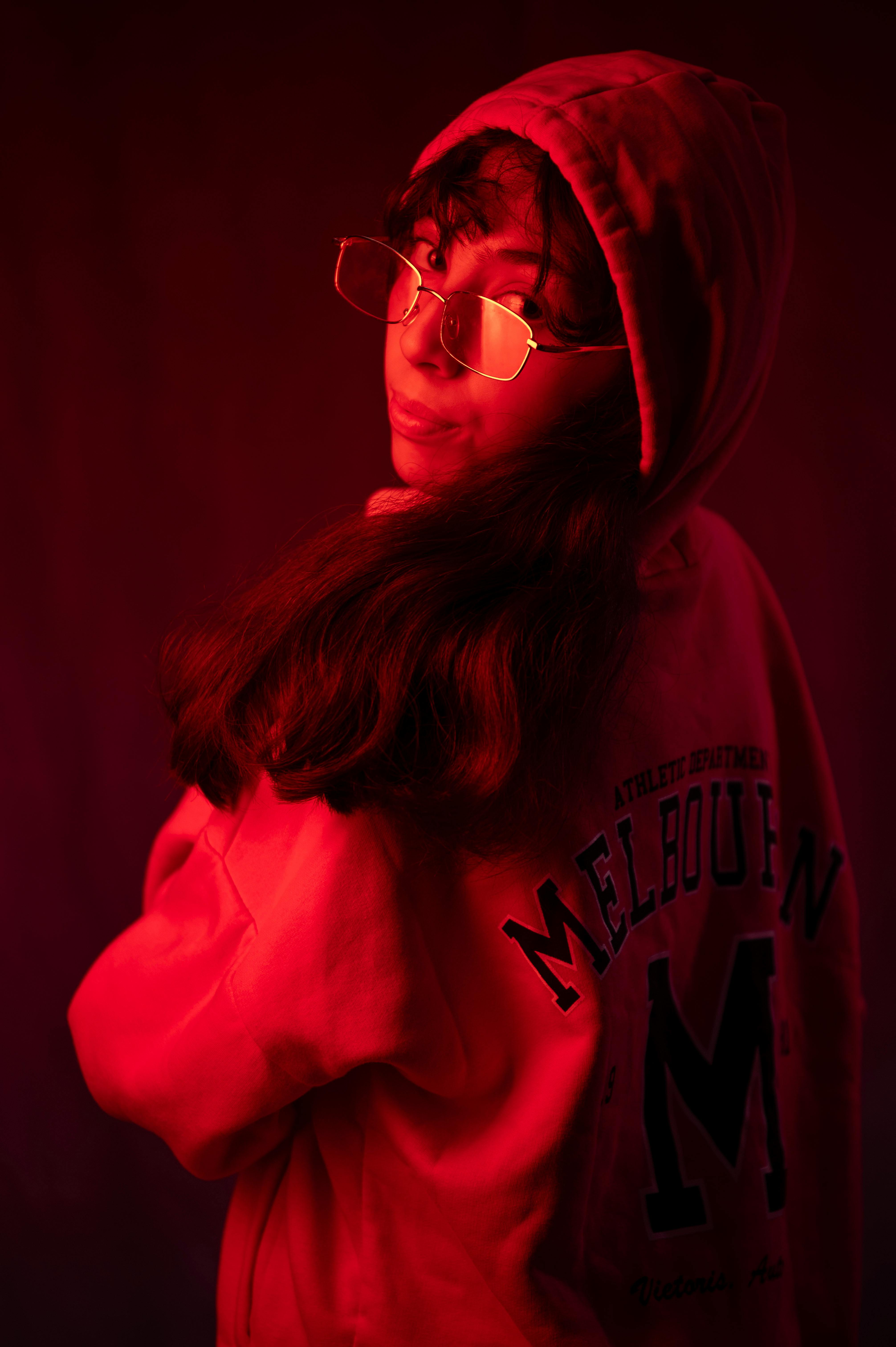 Hooded Woman Standing Red Light · Free Stock Photo