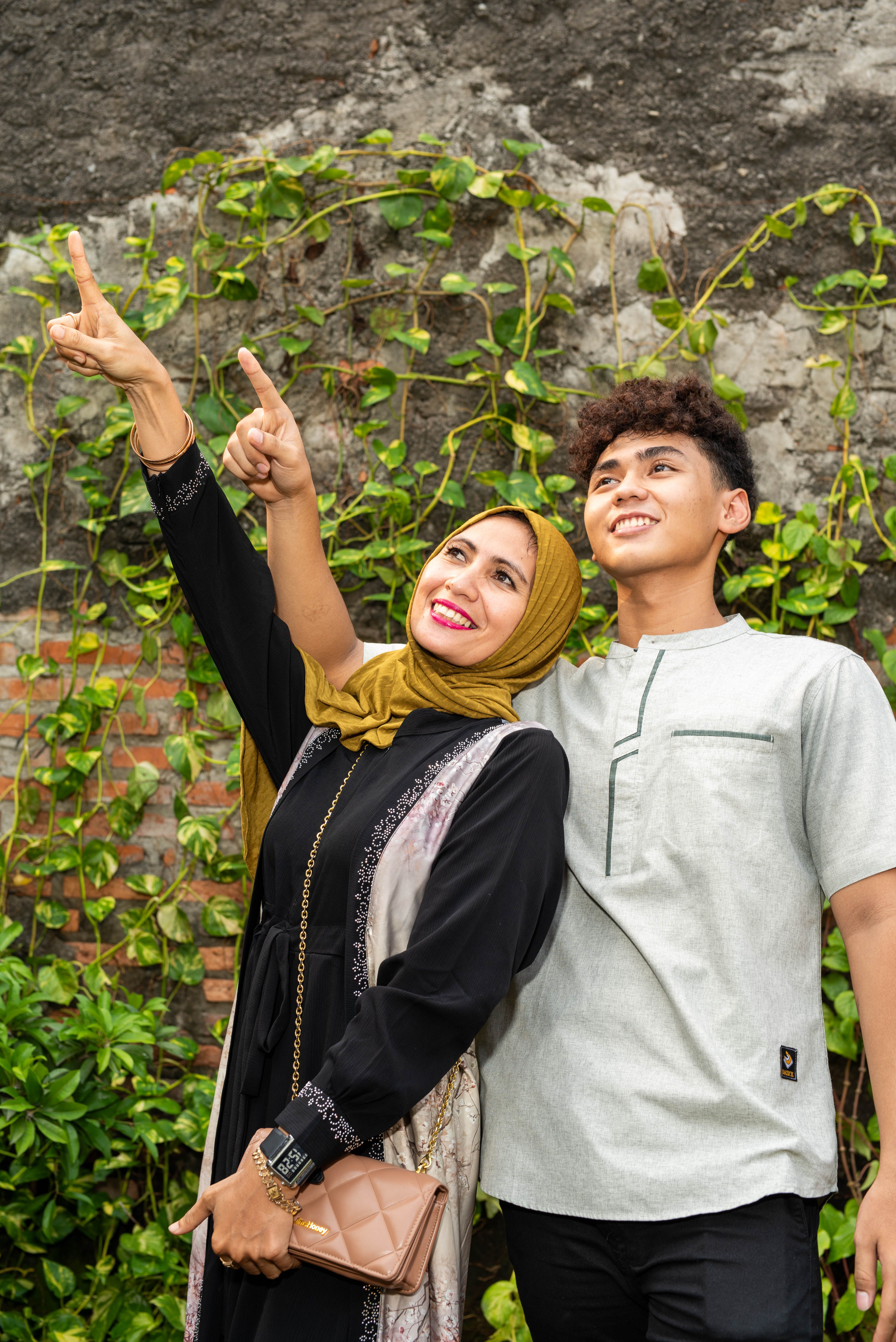 Smiling Woman and Man Looking Up · Free Stock Photo