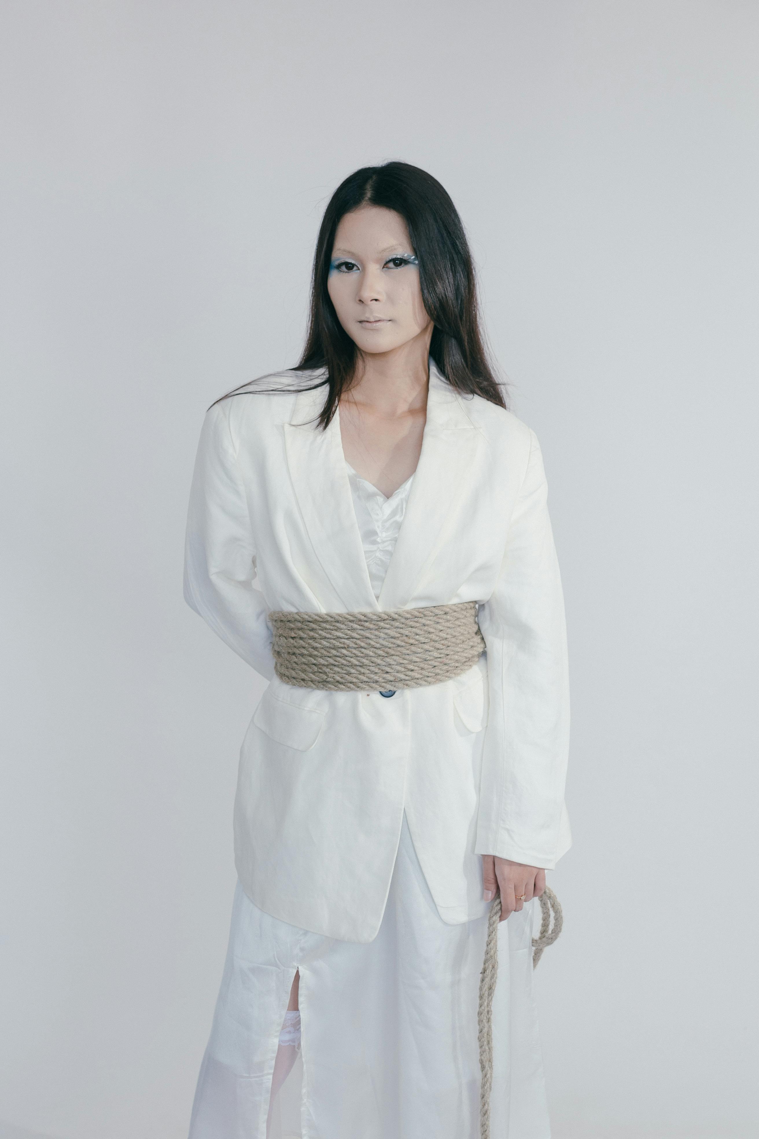 Model Dressed in White Wearing a Blazer Tied with a Rope · Free Stock Photo