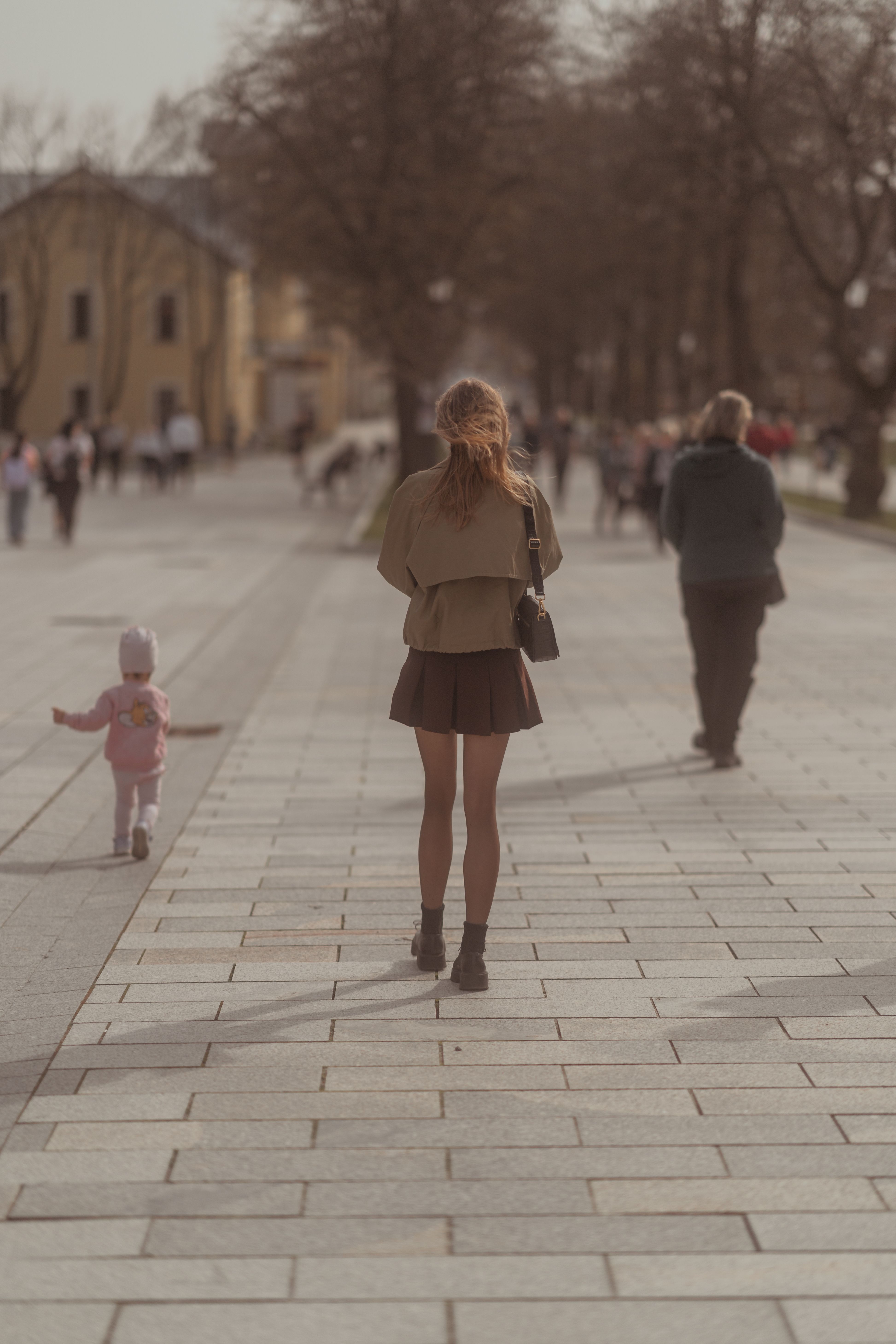 Woman Walking on Pavement · Free Stock Photo
