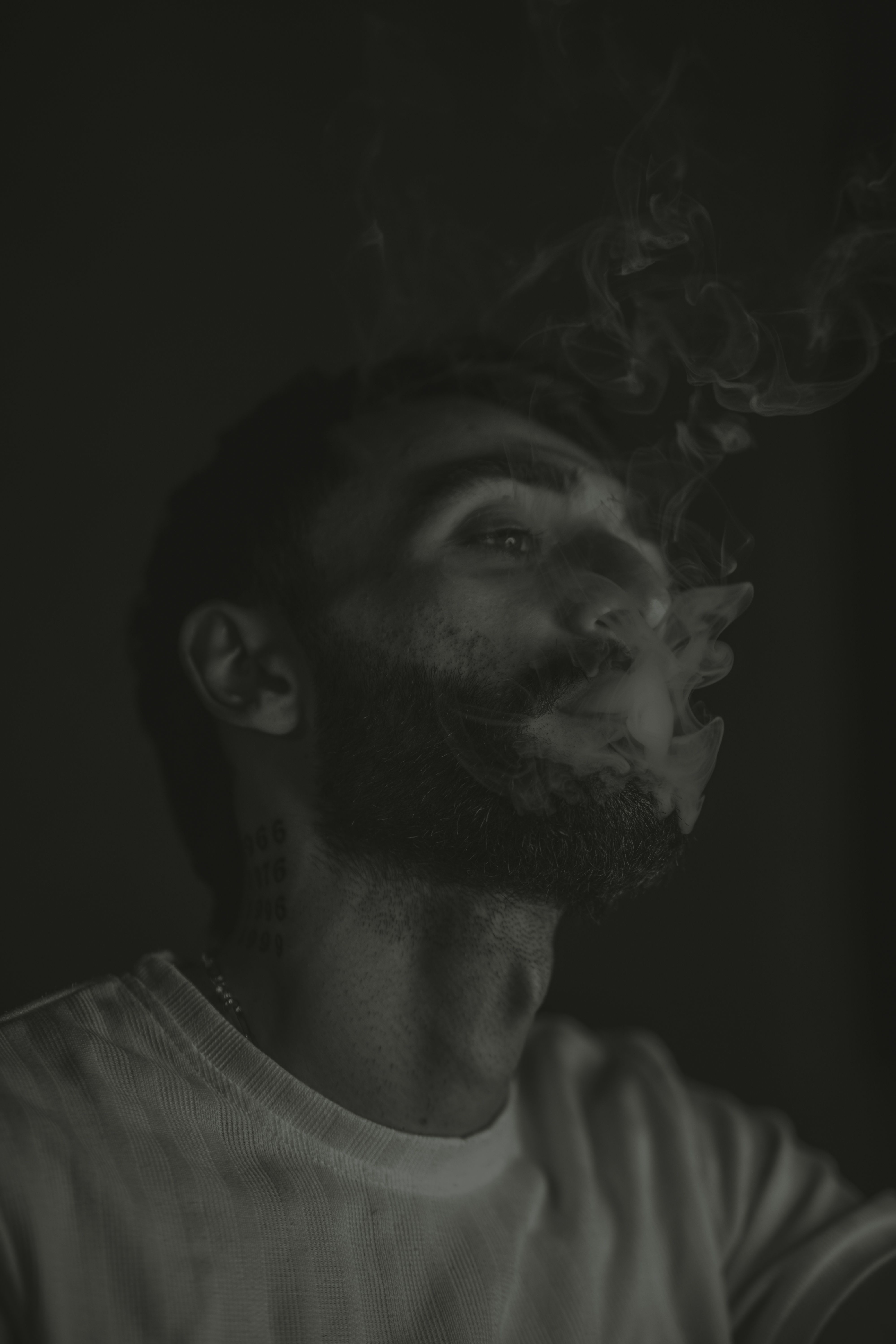 Man Blowing Smoke · Free Stock Photo