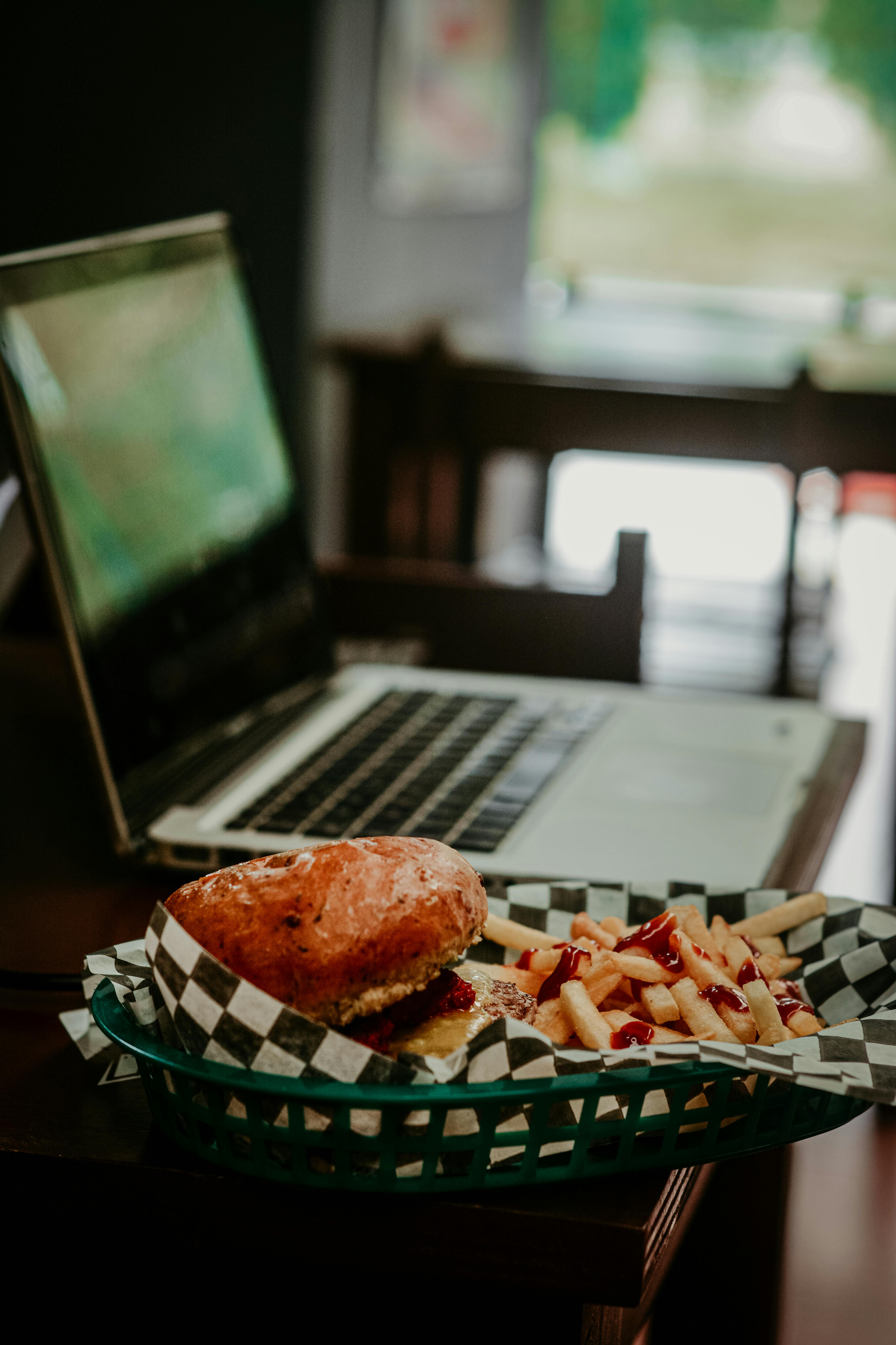 Fries and Burger near Laptop · Free Stock Photo
